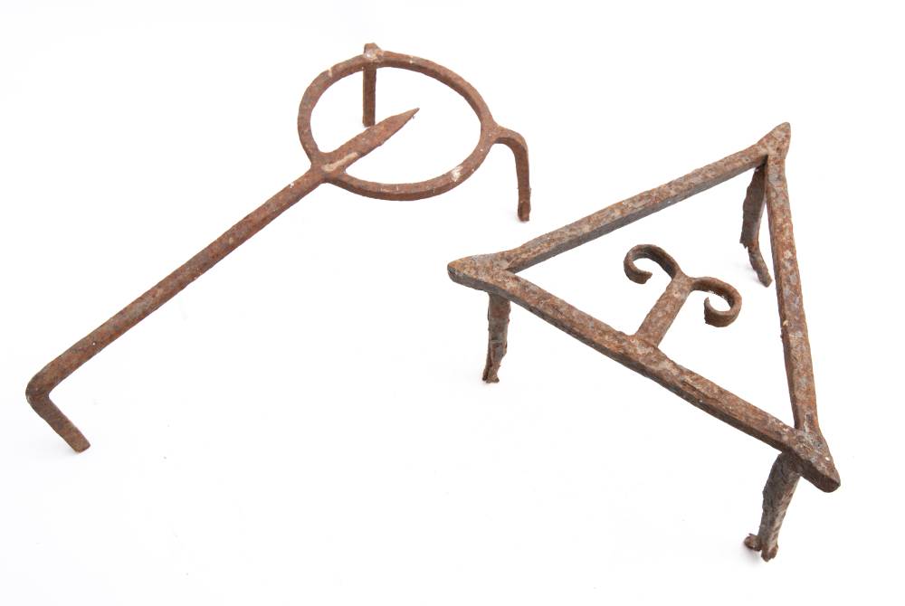 An iron brandreth of triangular shape: 31cm wide and an iron trivet ...
