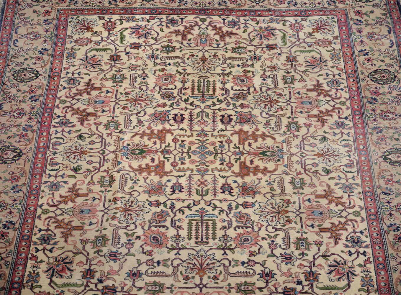 A TABRIZ CARPET SIGNED BY MASTER WEAVER JAVAN AMIR KHIZapproximately ...