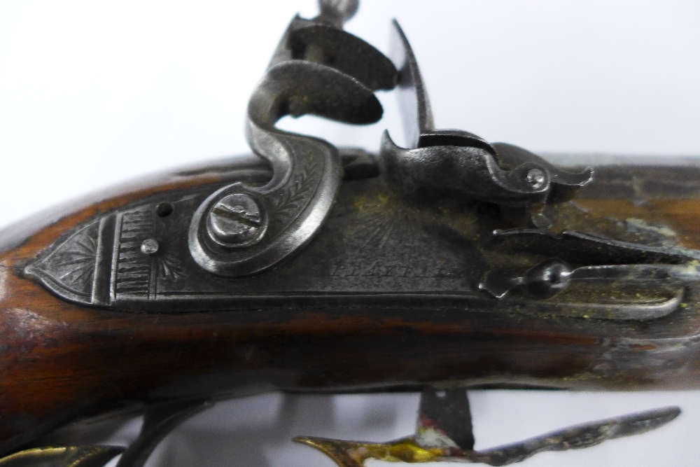 Flintlock short pistol with a 6" octagonal barrel, the steel plate ...