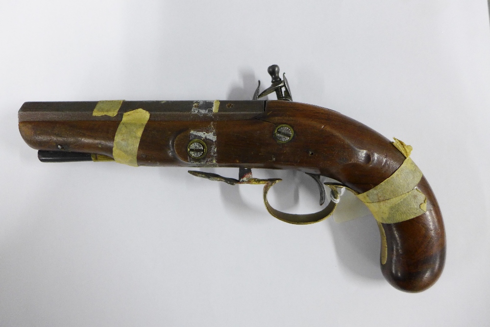 Flintlock short pistol with a 6" octagonal barrel, the steel plate ...