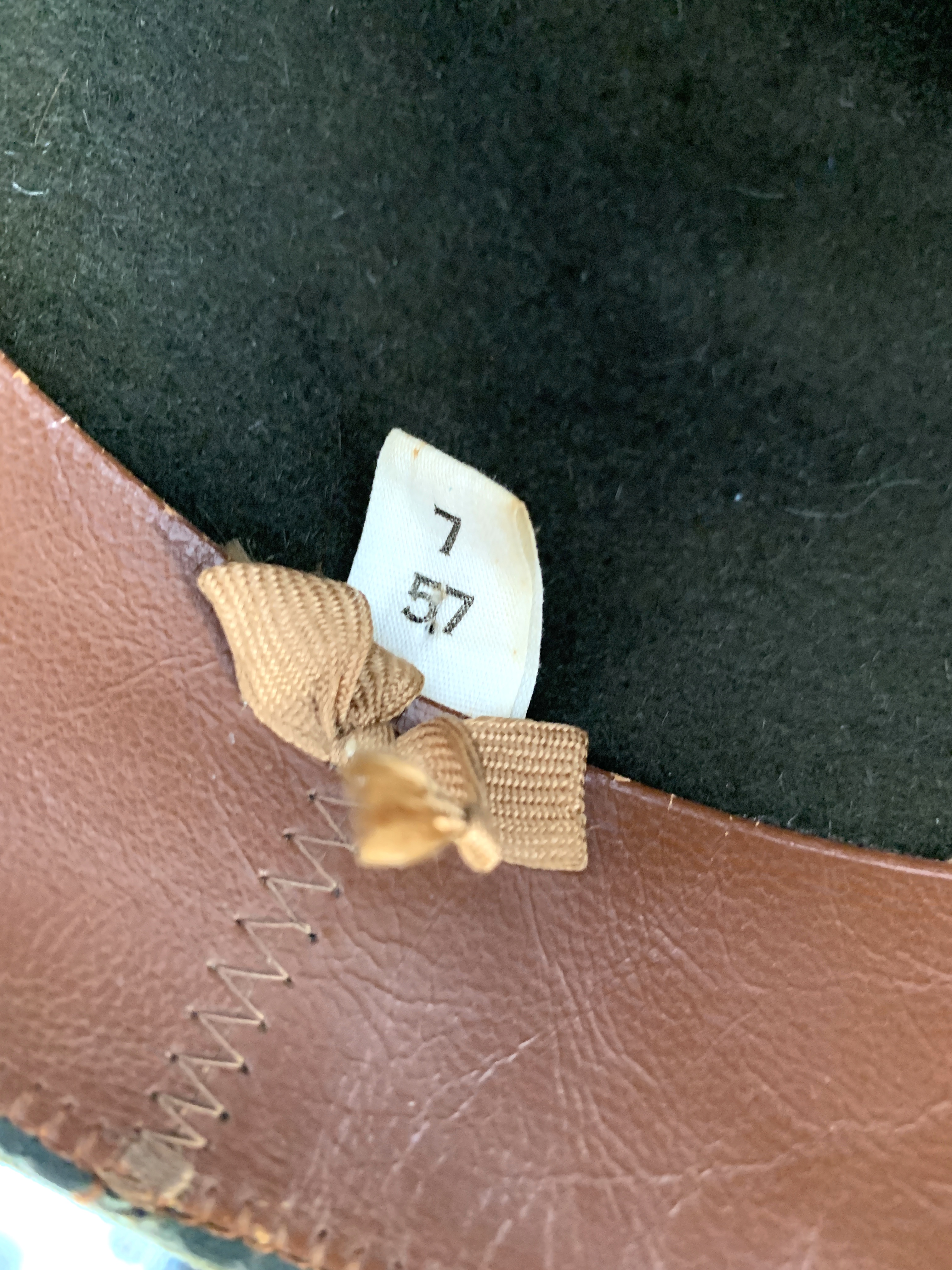 A Kendal Milne & Co olive felt racing trilby, size 7