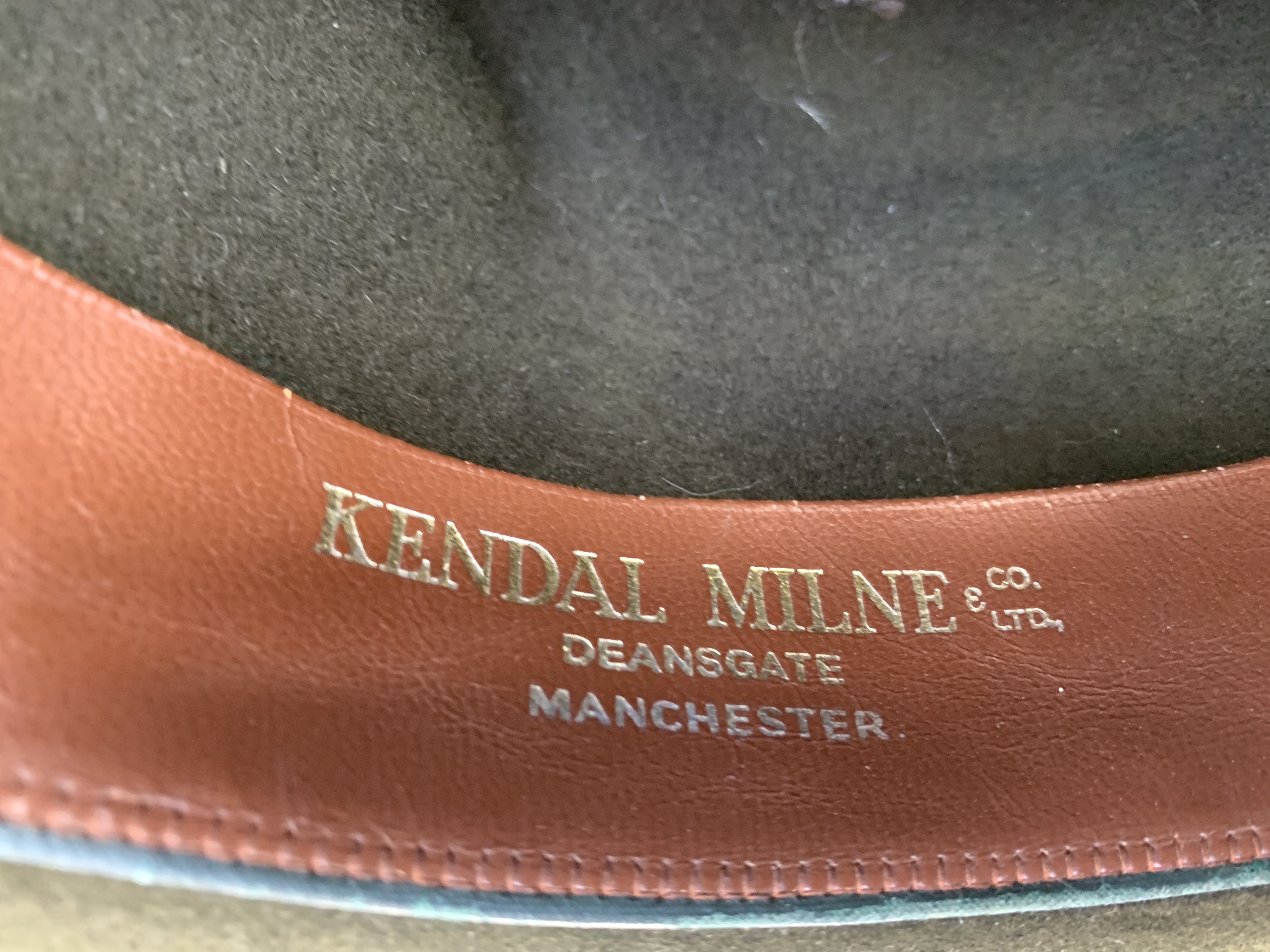 A Kendal Milne & Co olive felt racing trilby, size 7