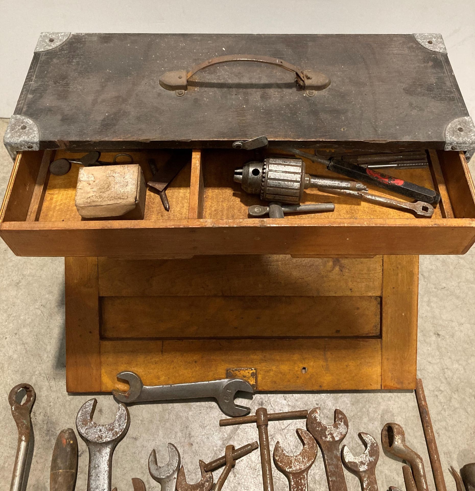 Wooden toolbox with drawer, containing a collection of hand tools ...