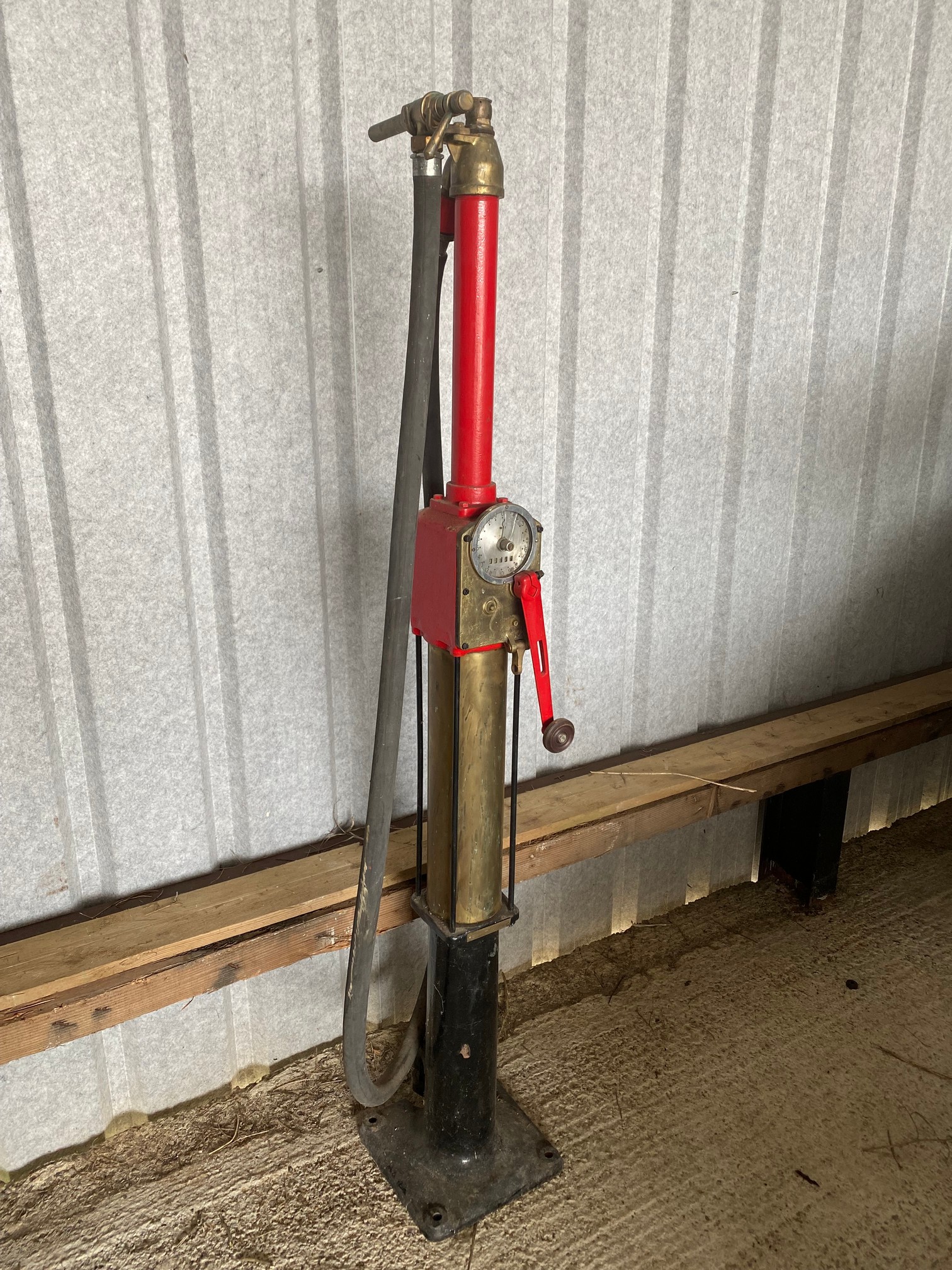 An Avery Hardoll CH1 petrol pump with rubber hose and bronze nozzle ...
