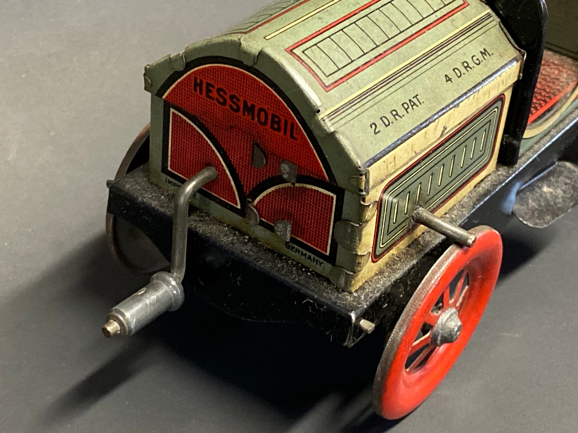 A superb German tinplate clockwork model of a veteran motor car by ...