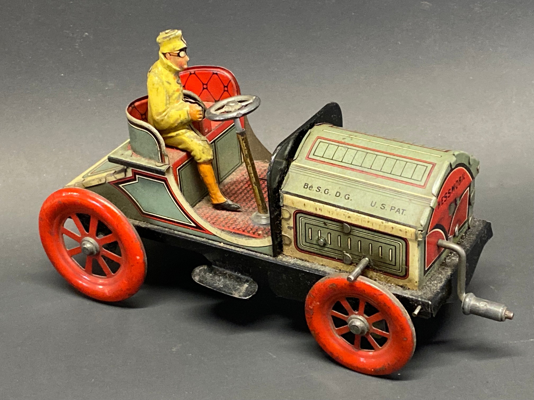 A superb German tinplate clockwork model of a veteran motor car by ...