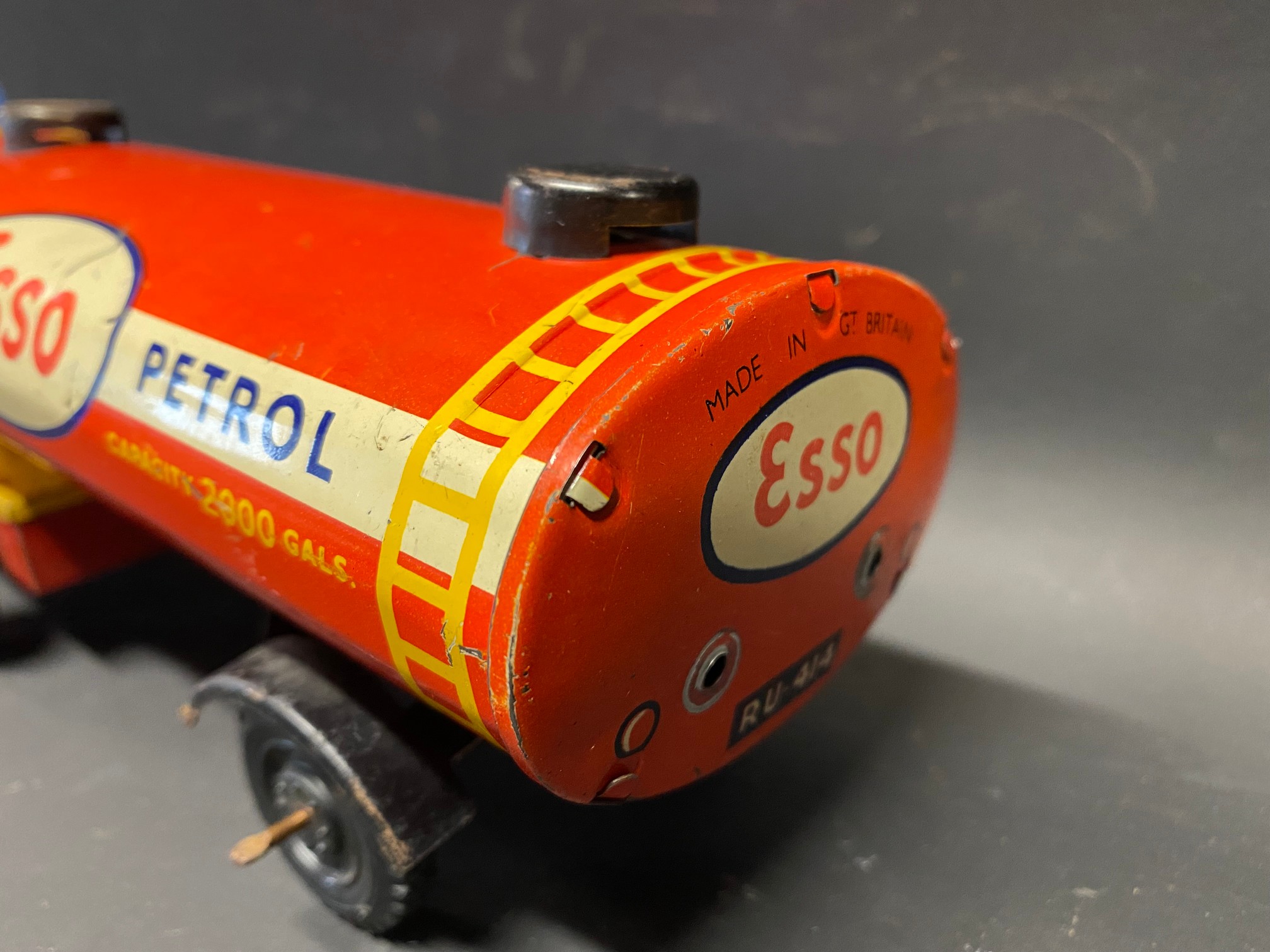 A Brimtoy tinplate and plastic model of an articulated Esso petrol tanker.