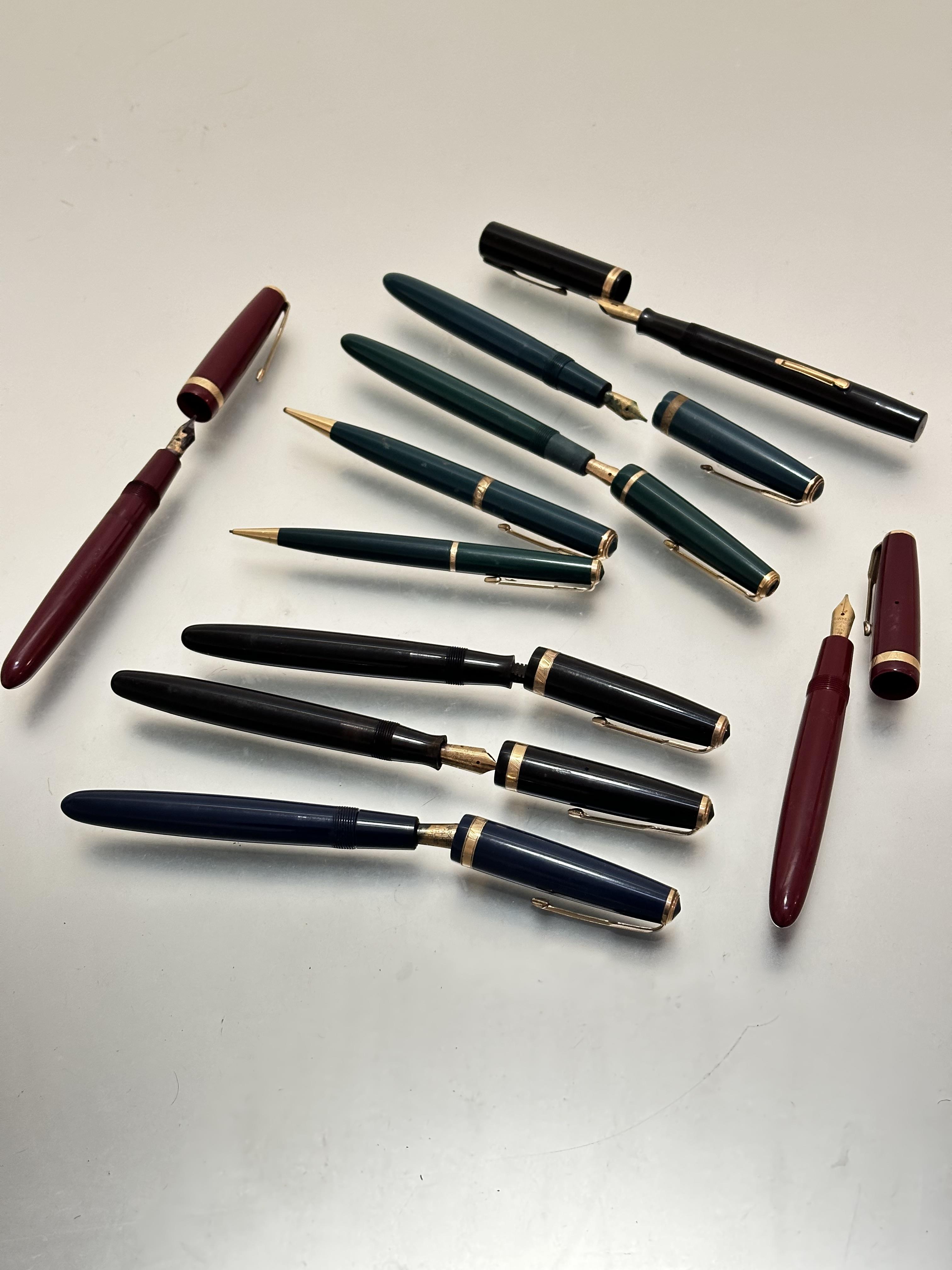 A collction of Parker fountain pens and propelling pencils, including ...