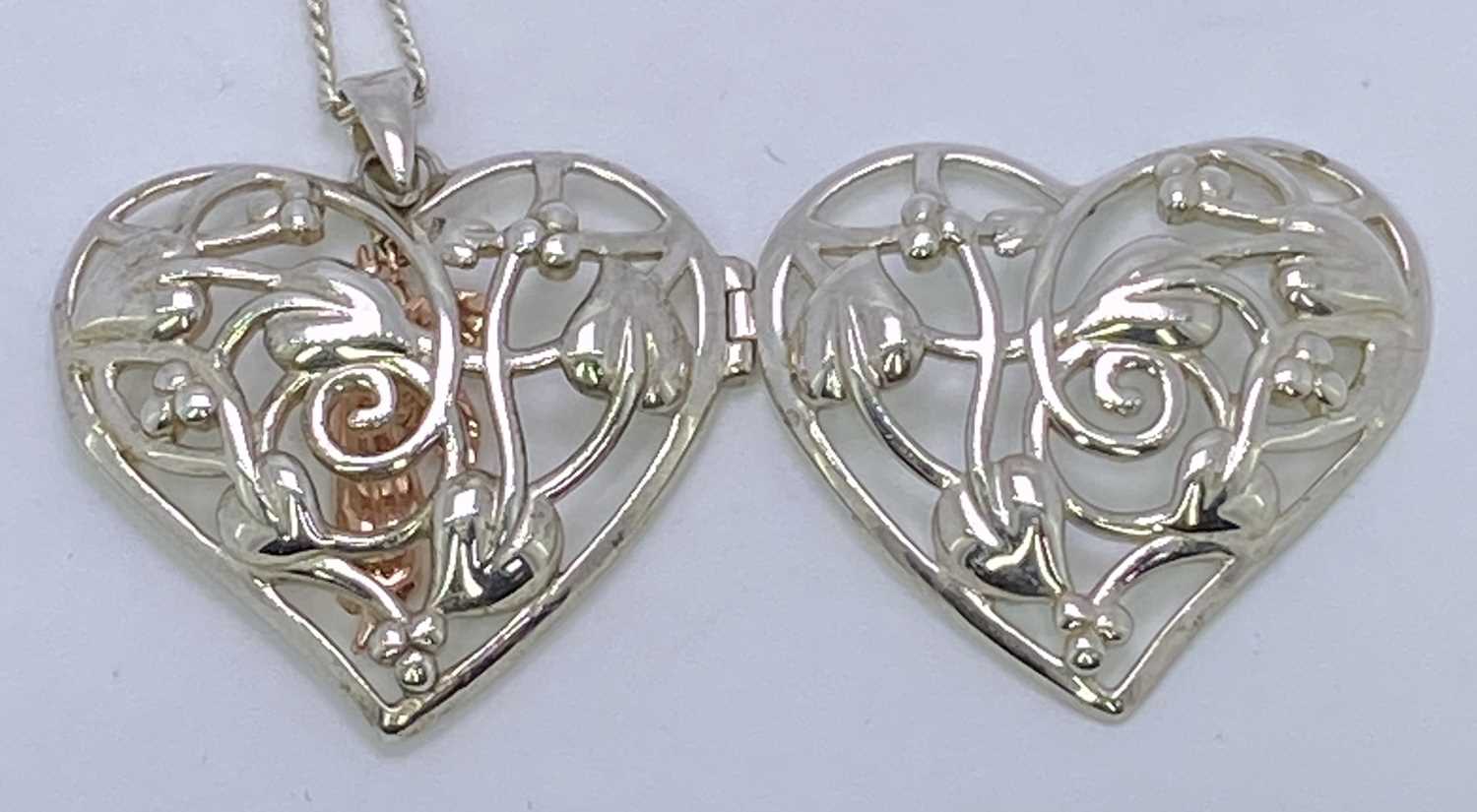 CLOGAU STERLING SILVER 'SMALL FAIRY LOCKET' - comprising a pair of ...