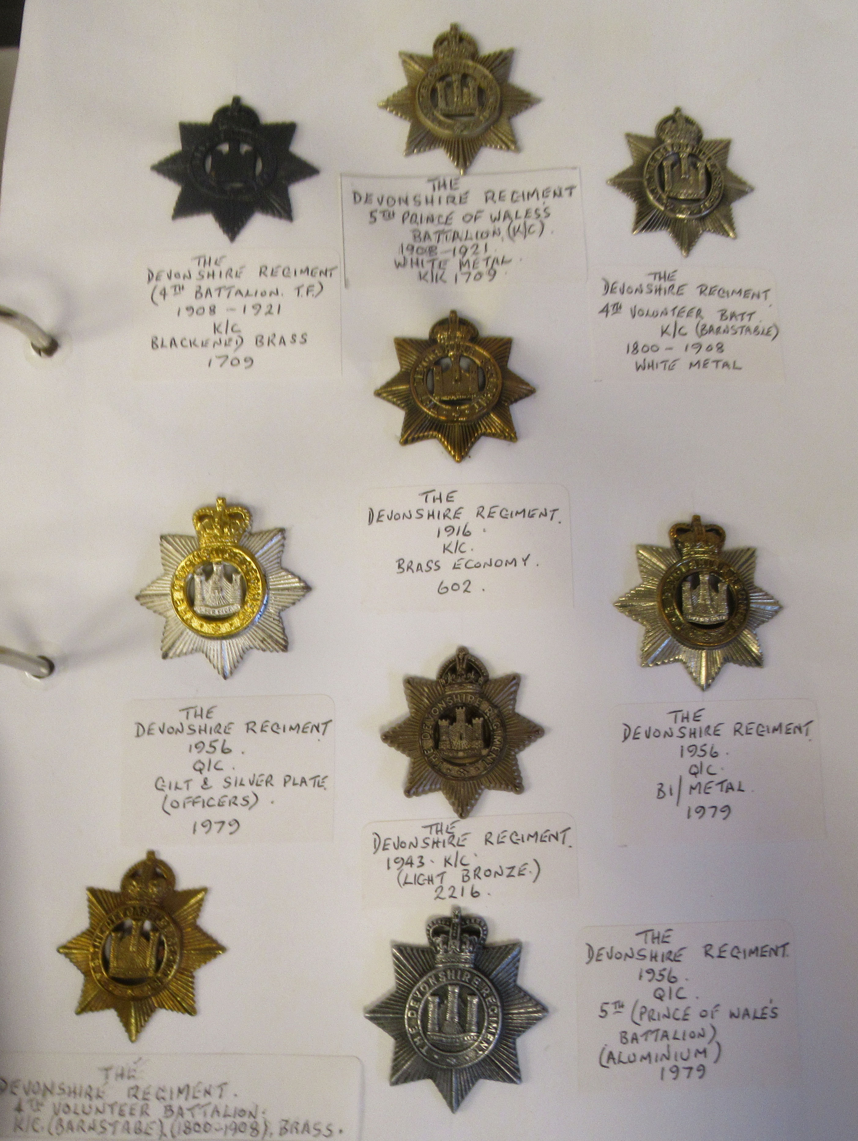 An album collection of fully identified British military badges, some ...