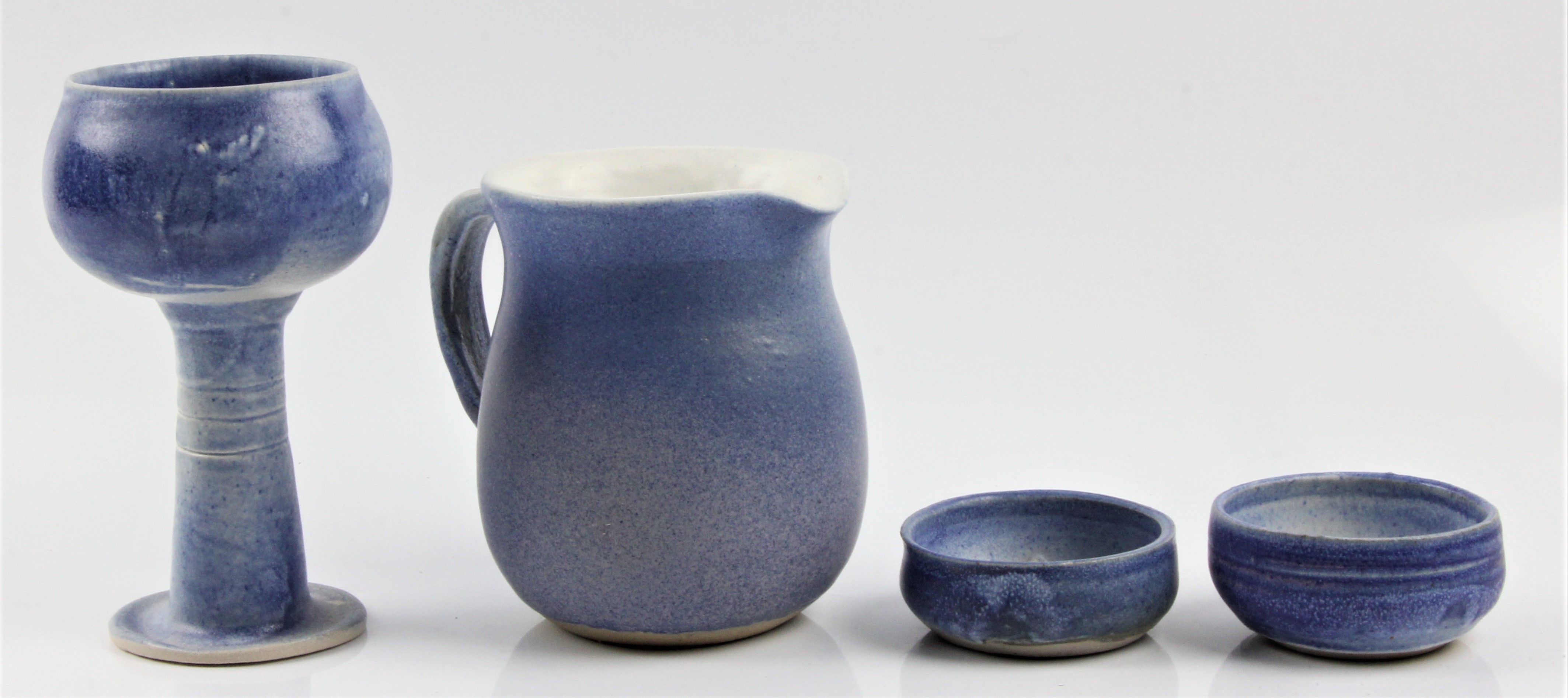 Two Molly Finlayson pottery studio vases, together with a goblet and a ...