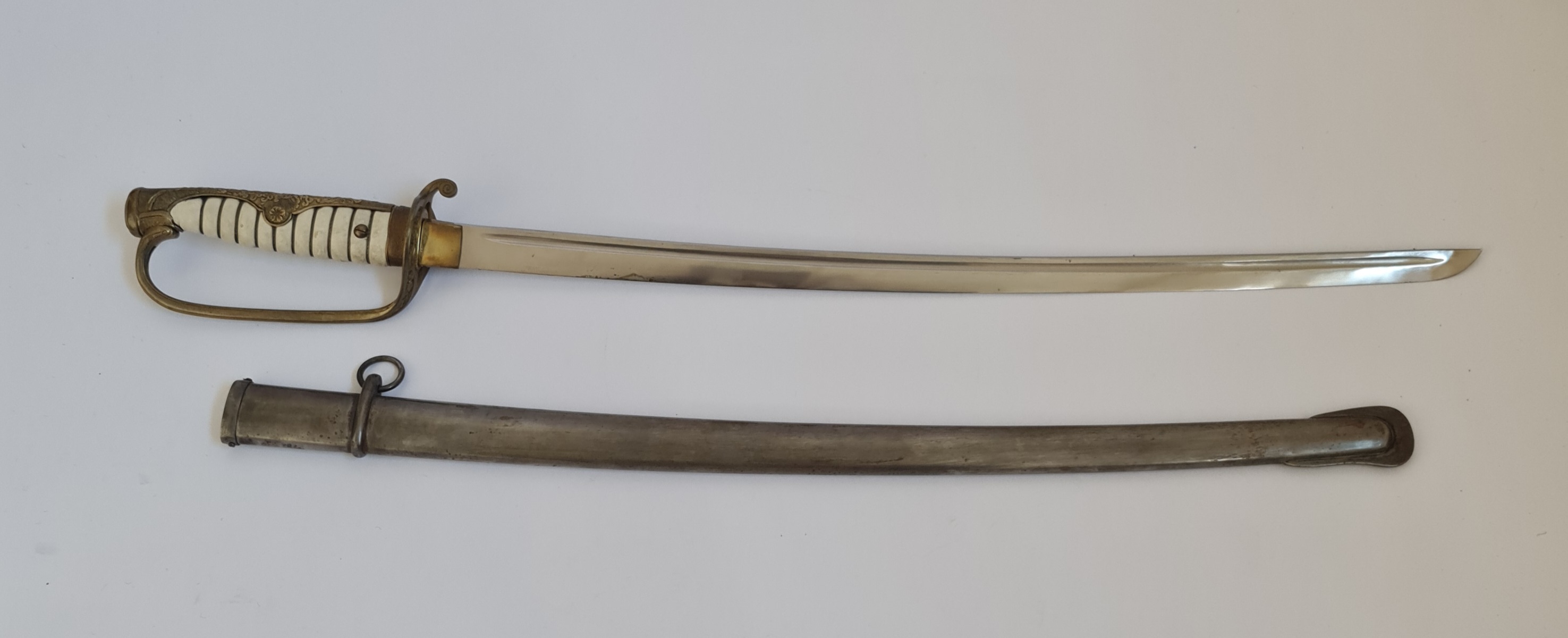 A WW2 Japanese Russo sword with brass D-guard and metal scabbard.