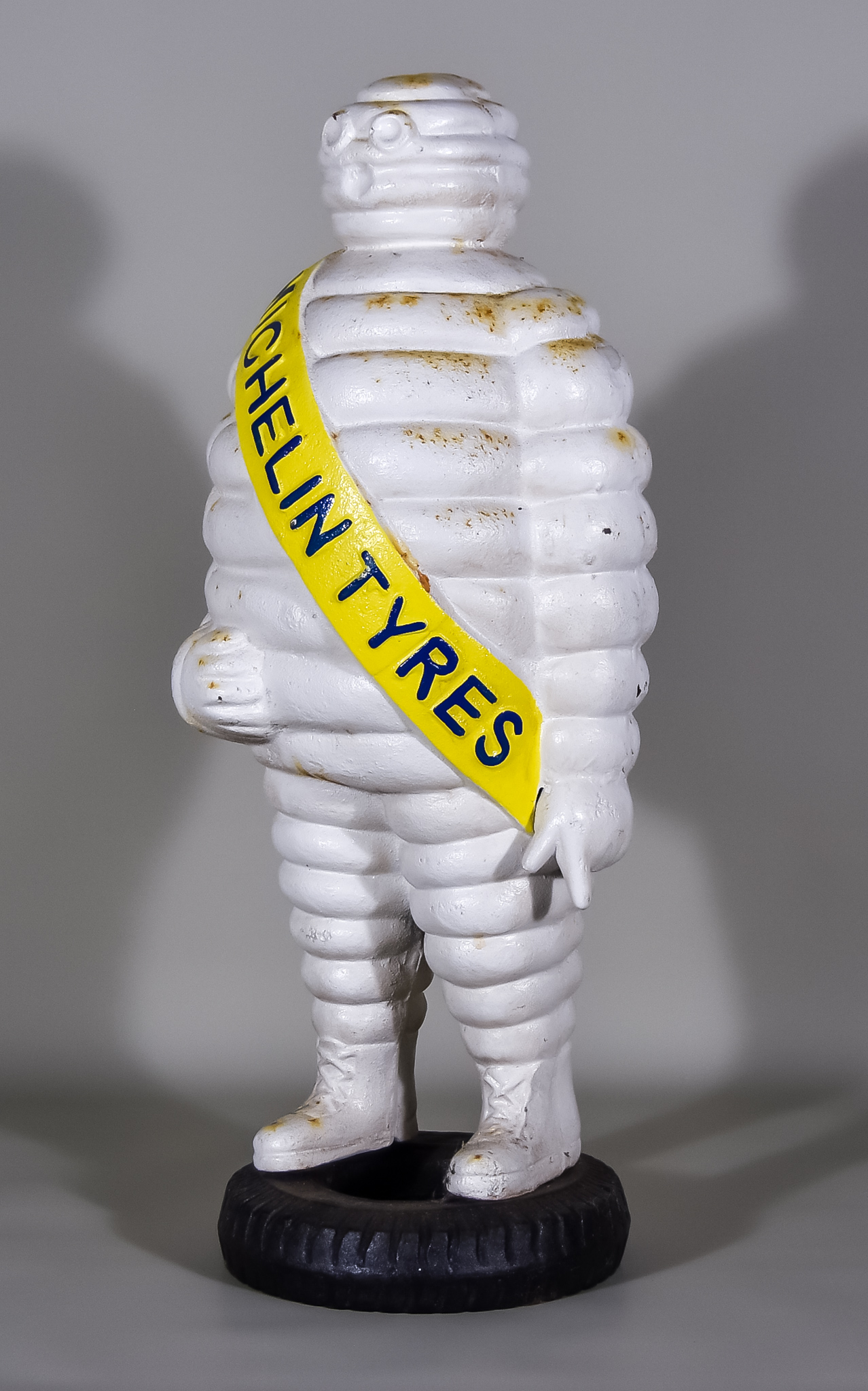 A French Cast Iron Michelin Man Advertising Figure Standing on a Tyre ...