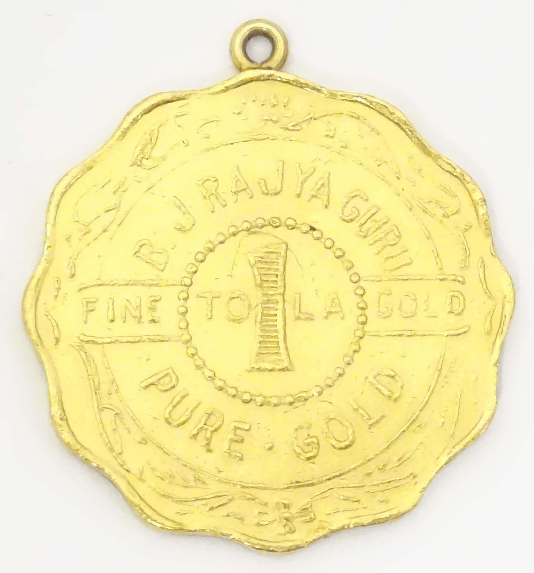 An Indian 1 Tola coin 'B.J. Rajyaguru, Fine Gold, Pure Gold' with ...