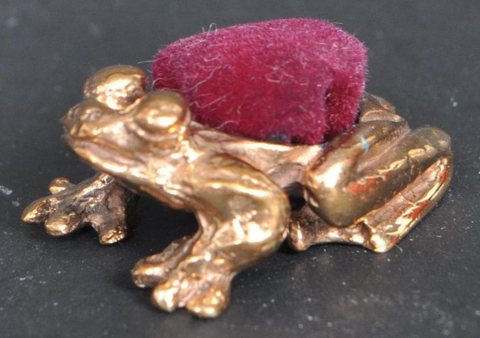 A vintage style 20th century brass pin cushion in the form of a frog ...