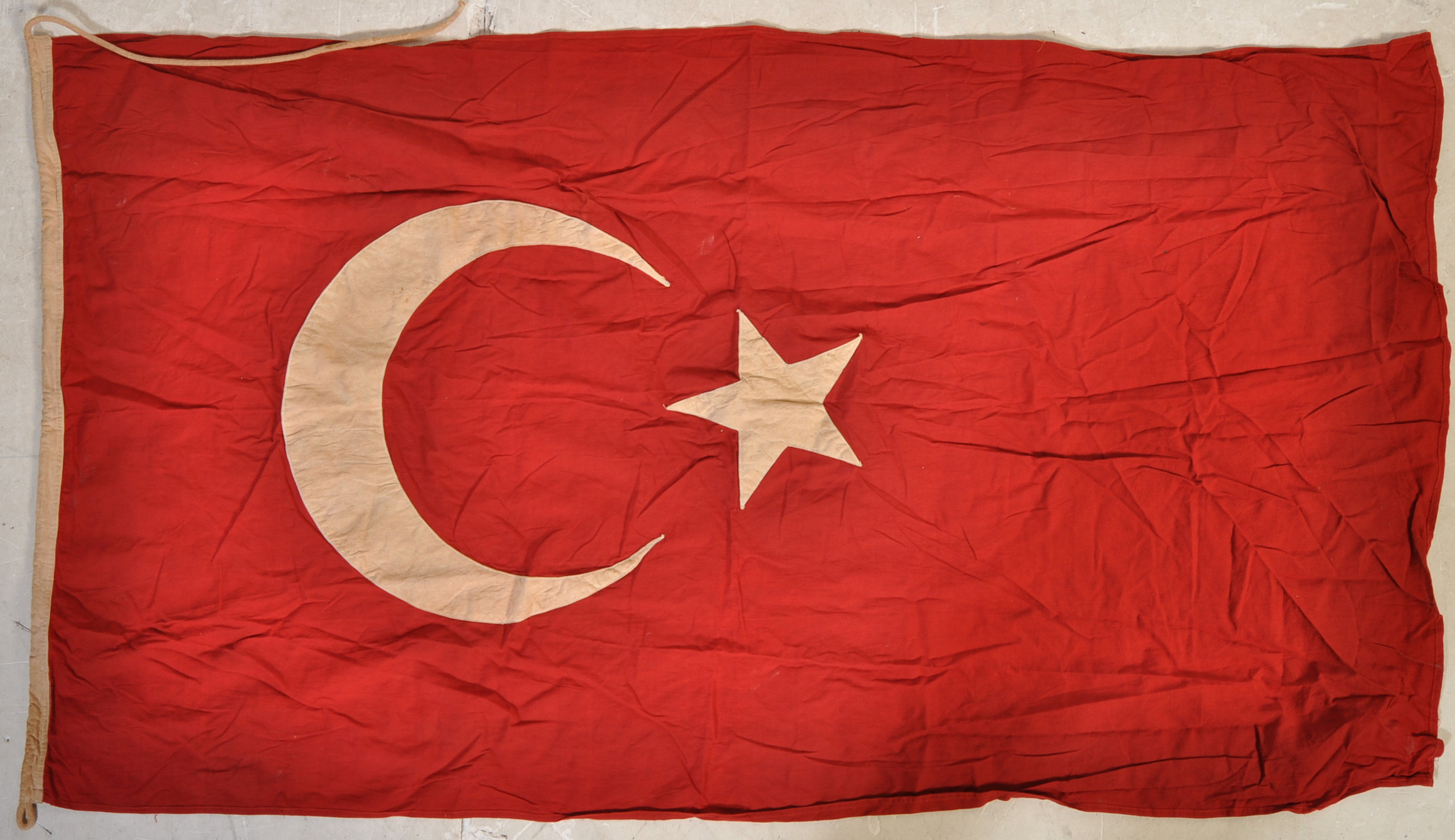 A late Ottoman Empire ' Sun and Crescent ' flag. Red ground with a ...