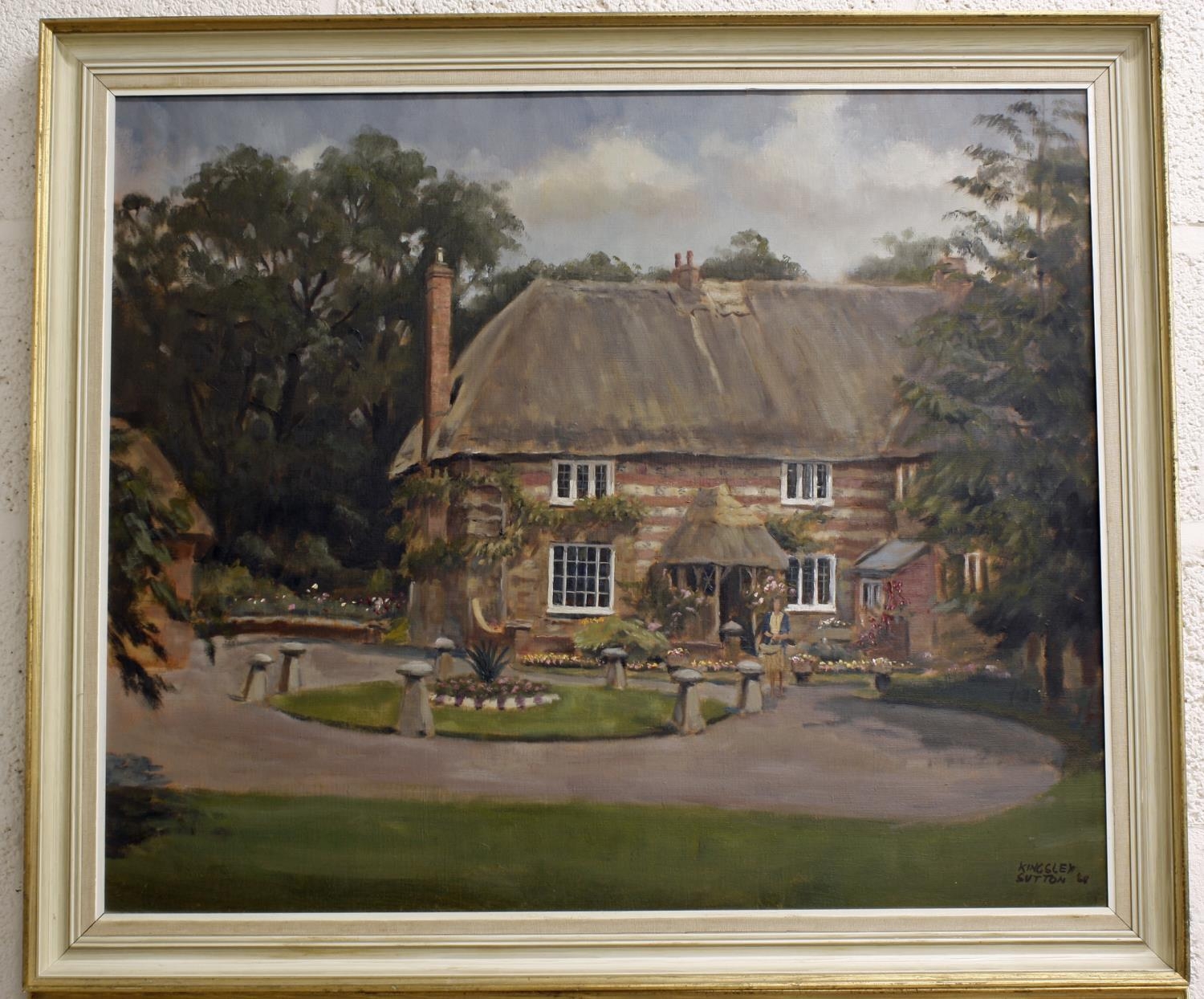 Kingsley Sutton (20th/21st century) - a lady in a garden beside a ...