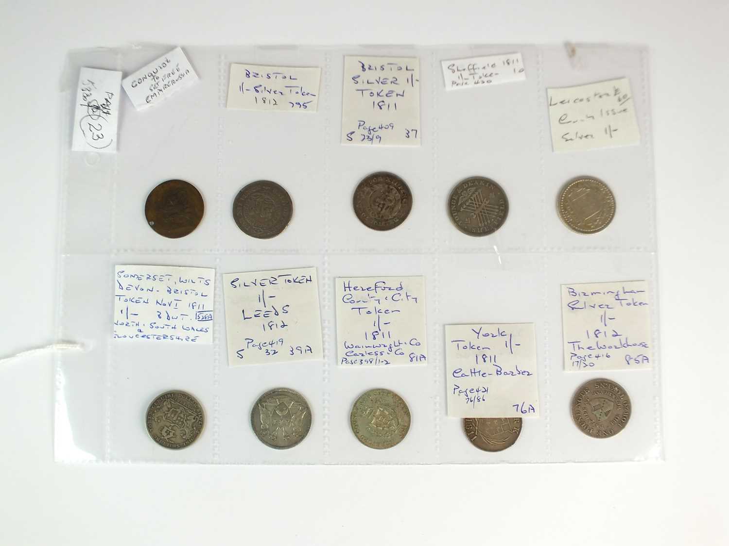 A collection of nine early 19th century silver shilling trade tokens ...