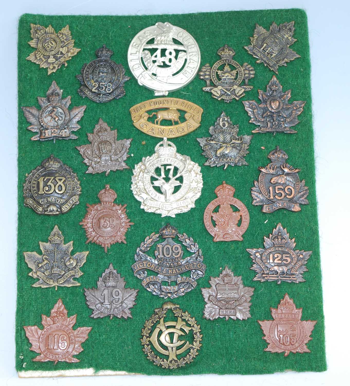 A collection of cap badges and insignia, being Canadian Regiments to ...