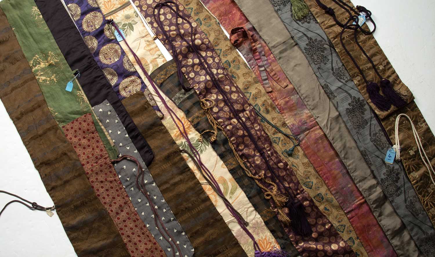 Large collection of silk and other katana cases and ...