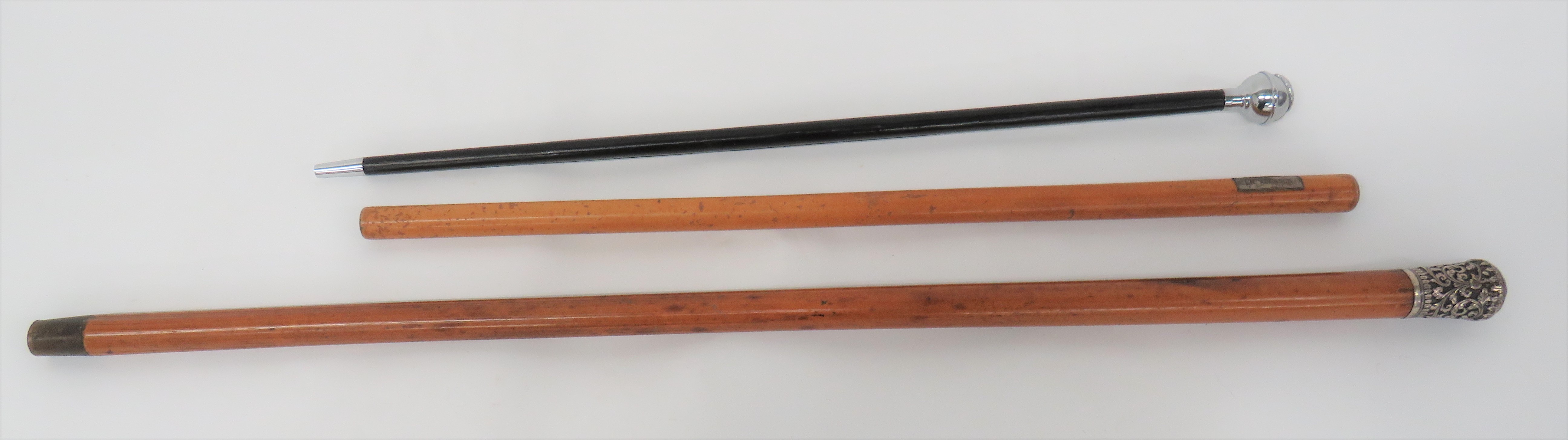 Three Various Officer Canes consisting plain malacca swagger stick with ...