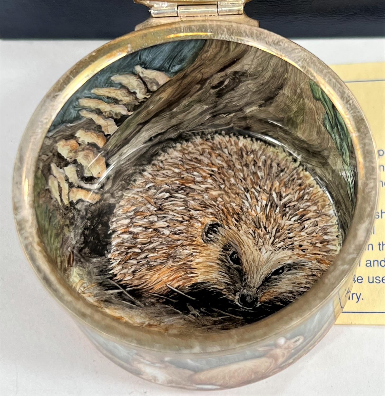 A Moorcroft enamel hand painted pill box decorated with fox, hedgehog ...