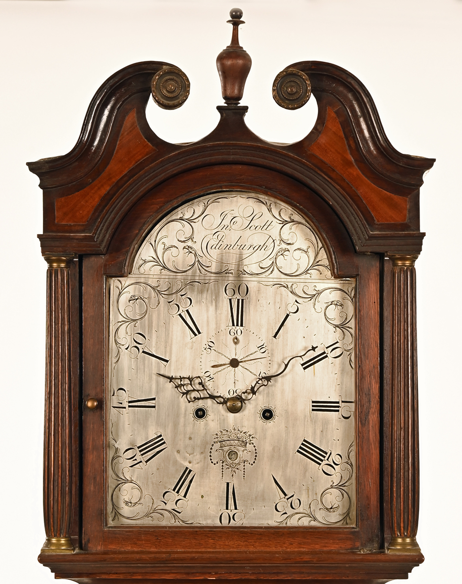 A George III oak cased swan neck pediment longcase clock with silvered ...