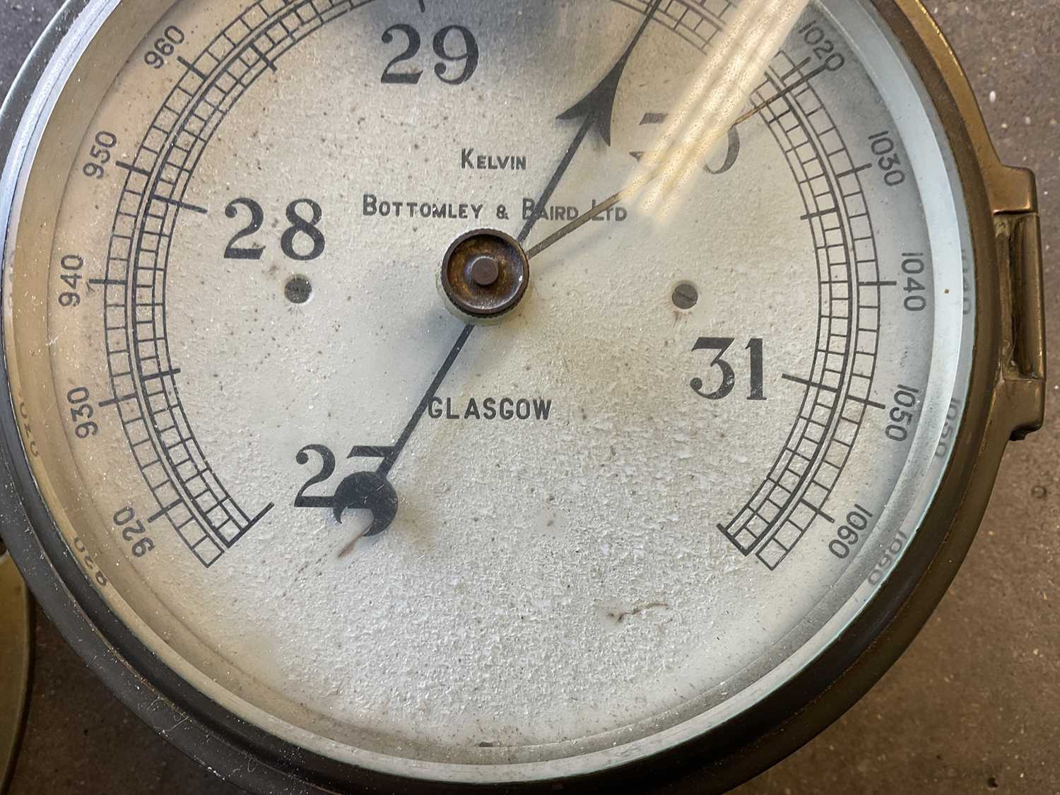 Bulkhead barometer by Bottomley and Baird, together with a ships clock