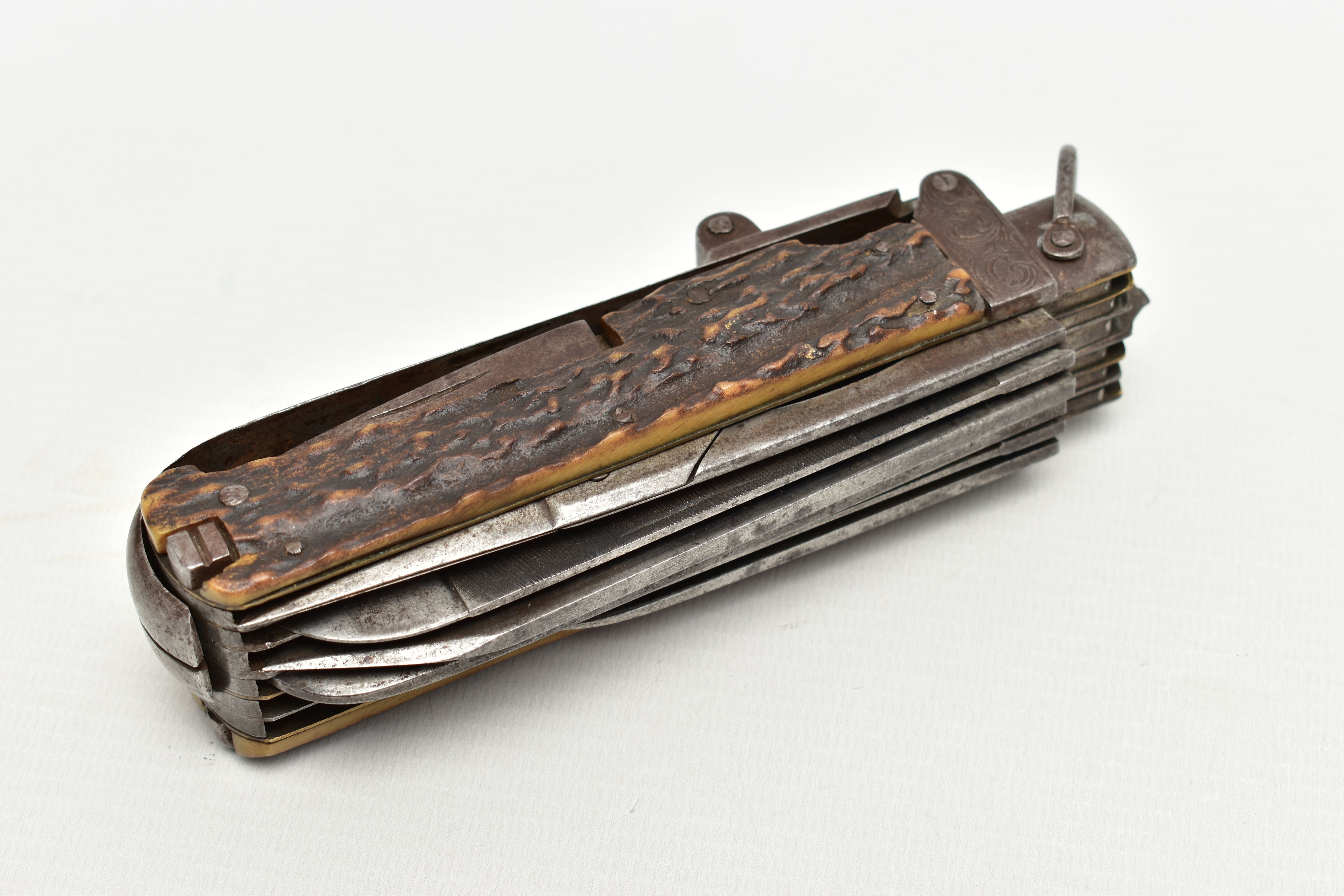 A VICTORIAN HORN AND STEEL MULTI-BLADED COACHMAN'S KNIFE, the folding ...