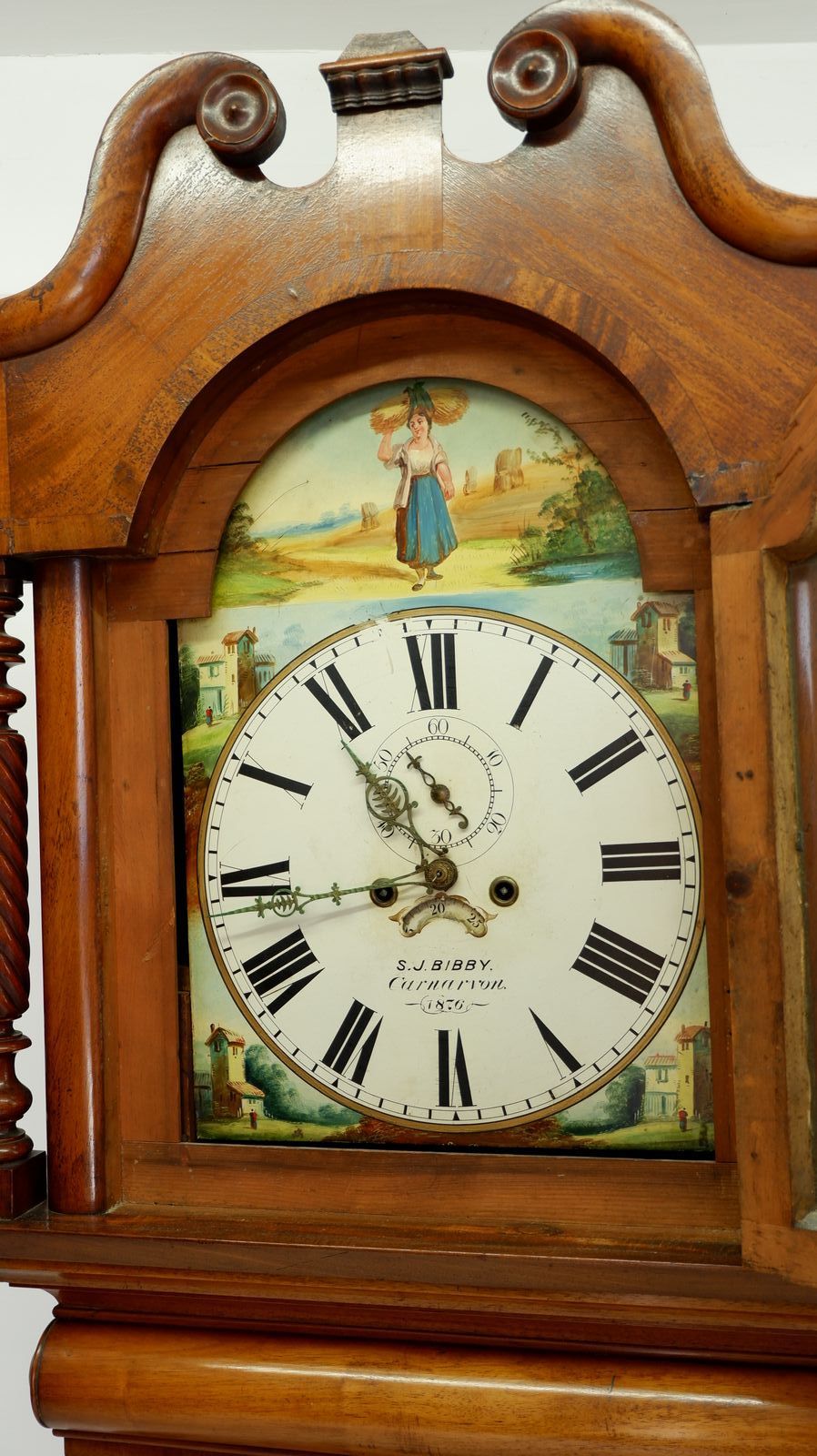 A Victorian mahogany longcase clock with swan neck pediment over carved ...
