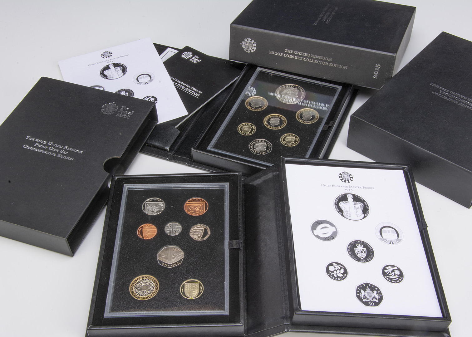 Three modern Royal Mint UK proof coin sets, including a 2013 ...