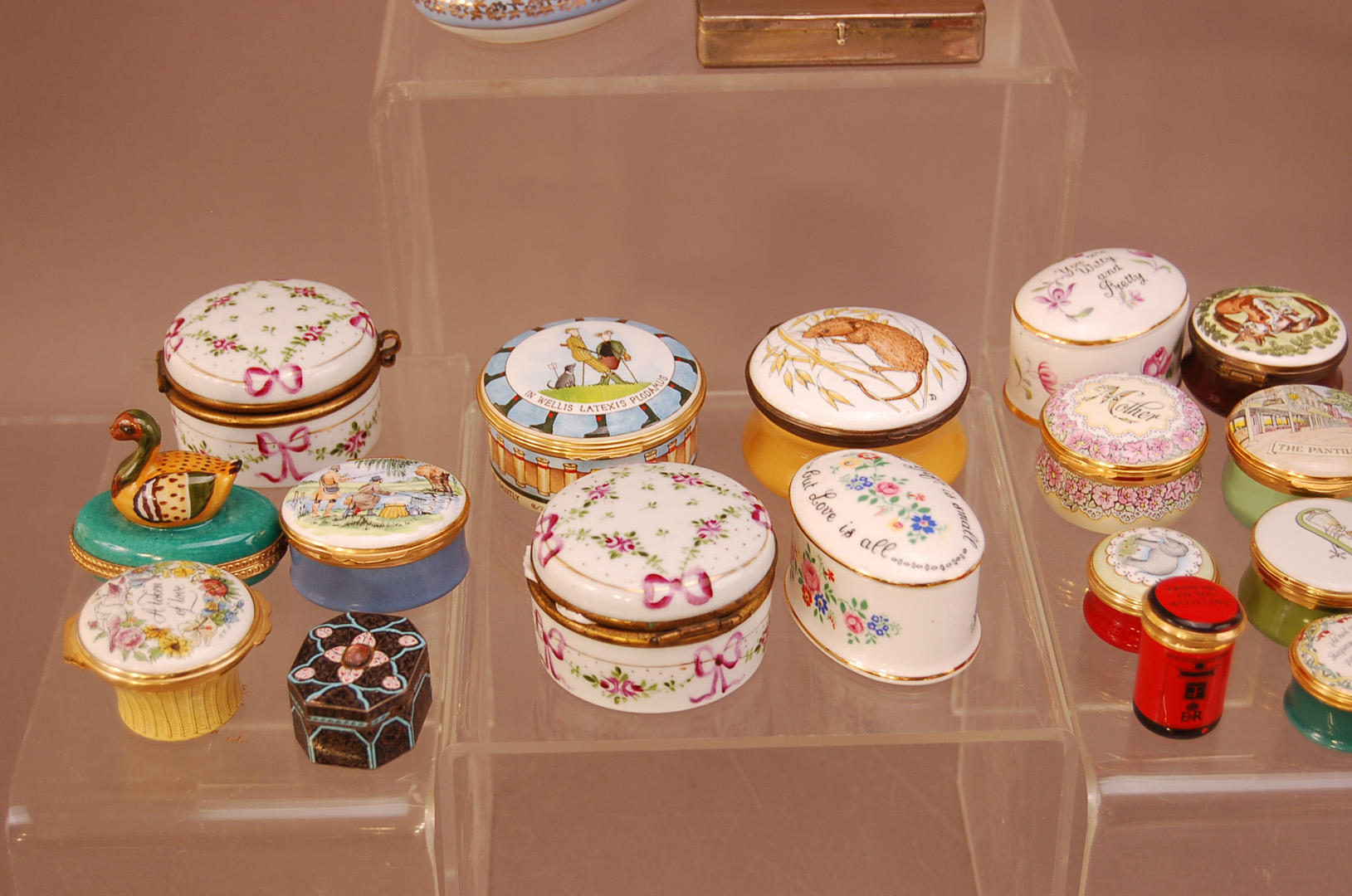 A large collection of small enamel boxes, including Halcyon days ...