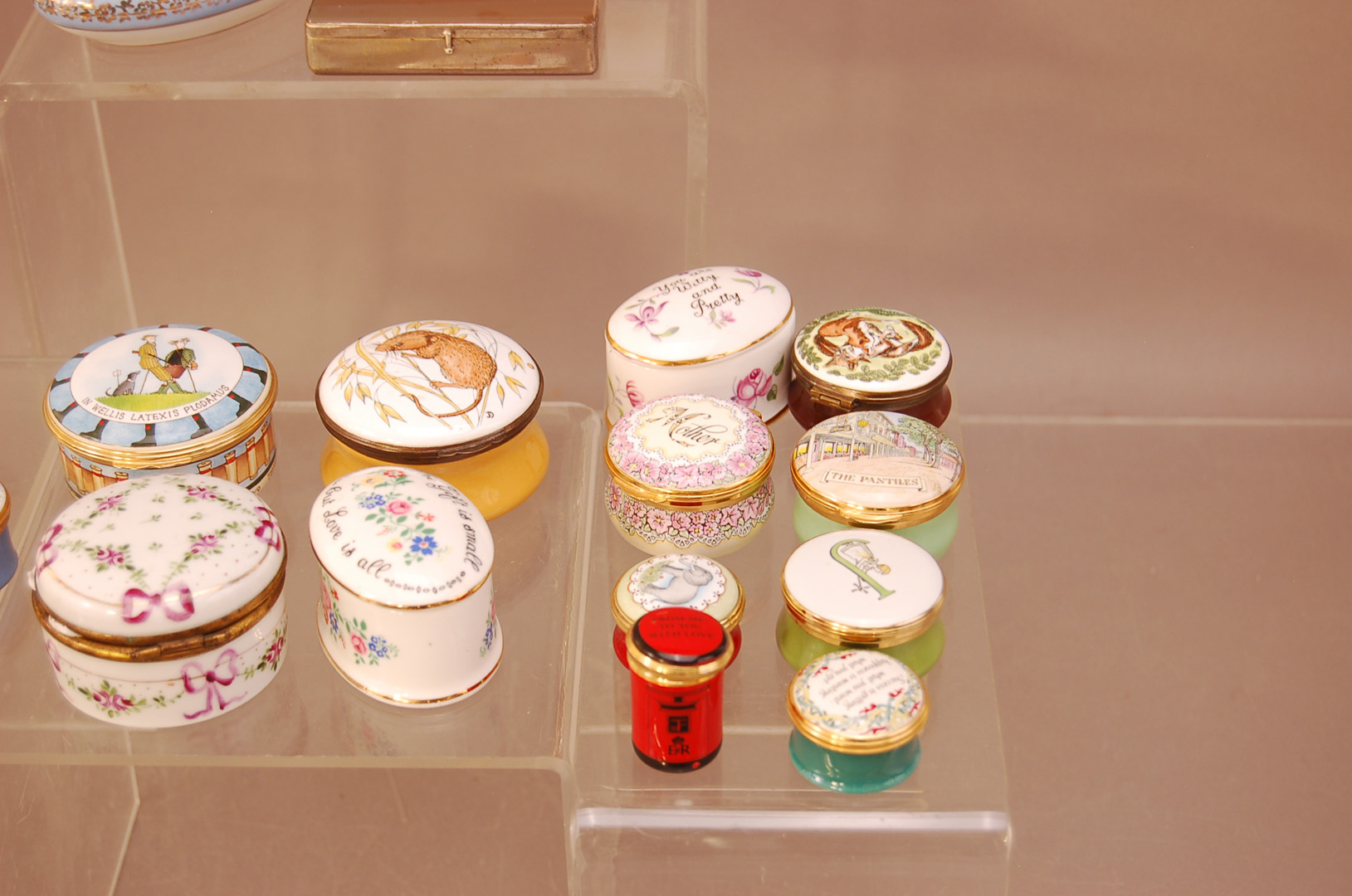 A large collection of small enamel boxes, including Halcyon days ...
