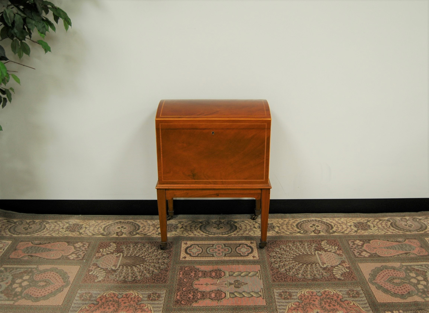 A 20th century mahogany and boxwood inlaid cellarette, domed top ...