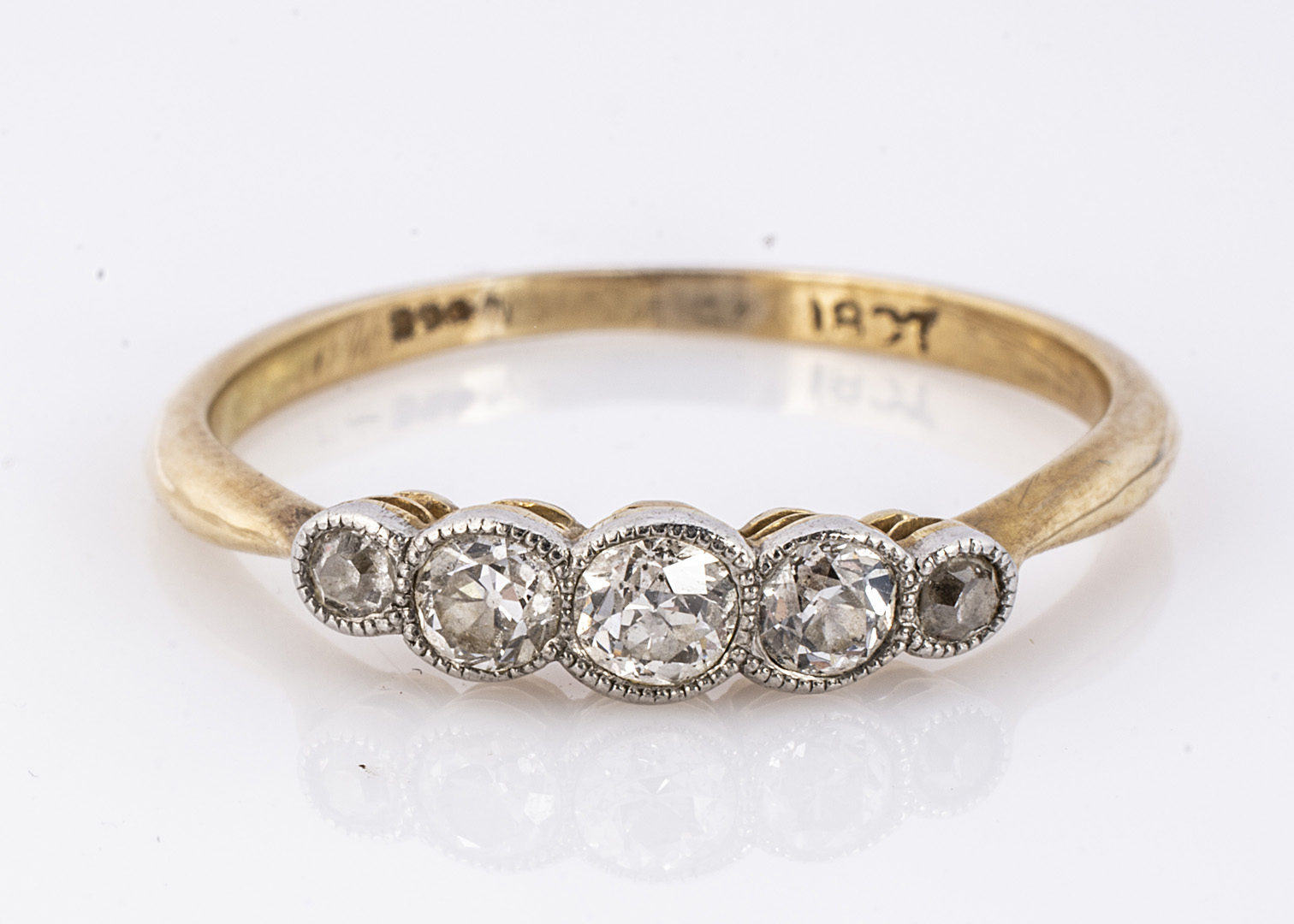 An 18ct and platinum five stone old cut diamond ring, millegrain ...