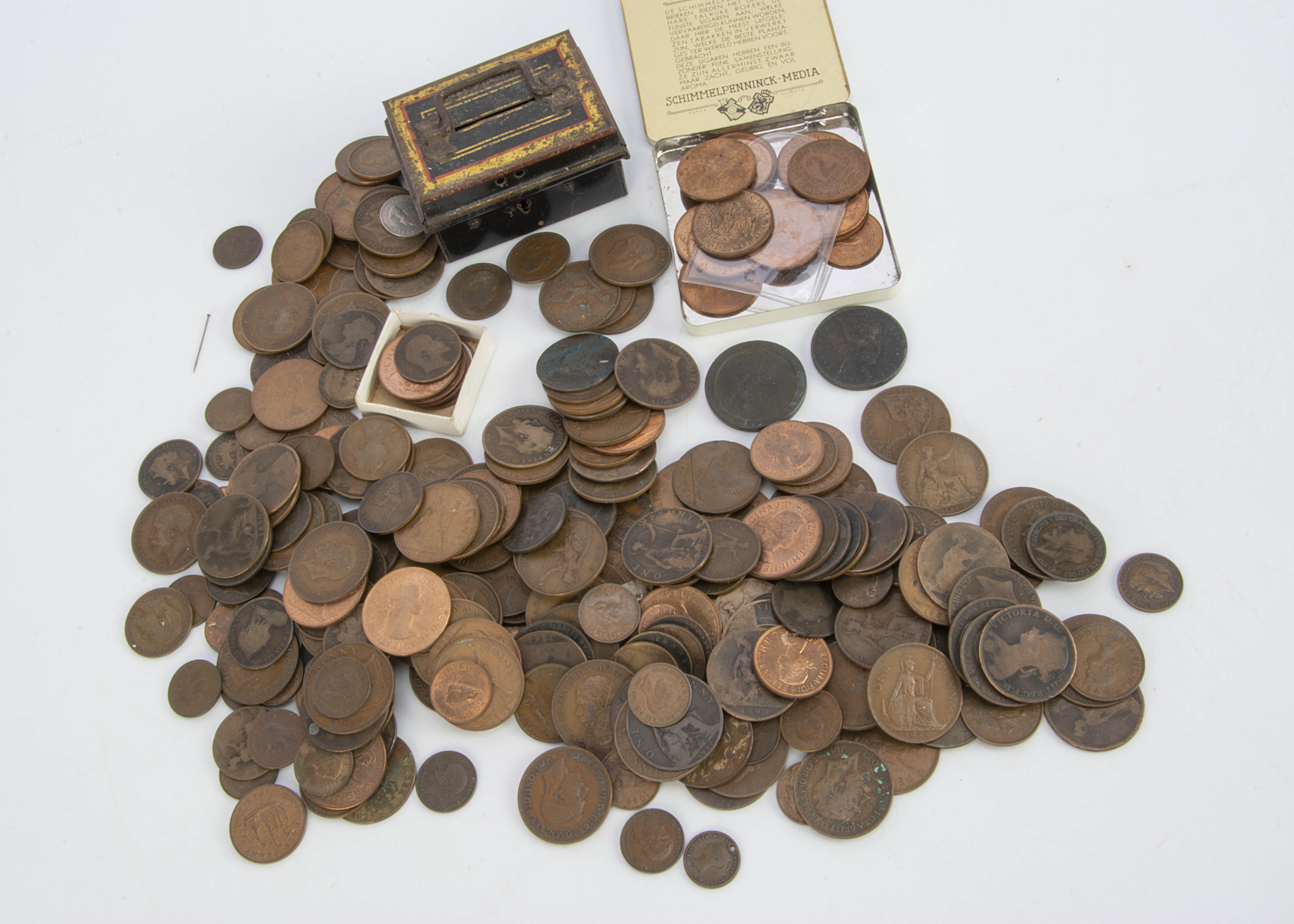 A collection of British pennies and other copper and copper style coins