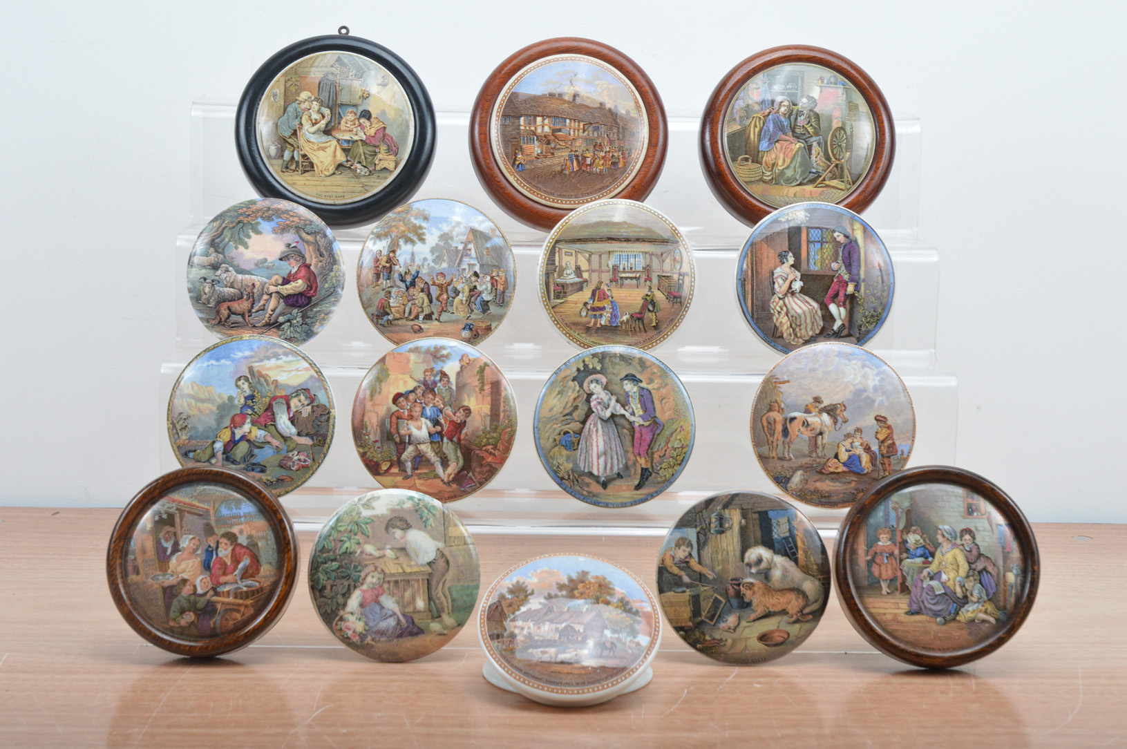 A collection of 19th century Staffordshire ceramic Prattware pot lids ...