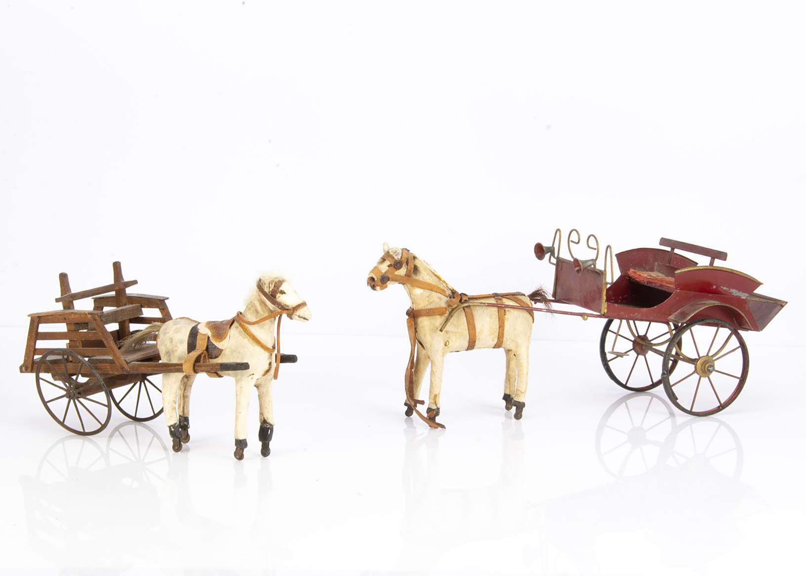 Two late 19th century horses and carriages, a dark red painted carriage ...