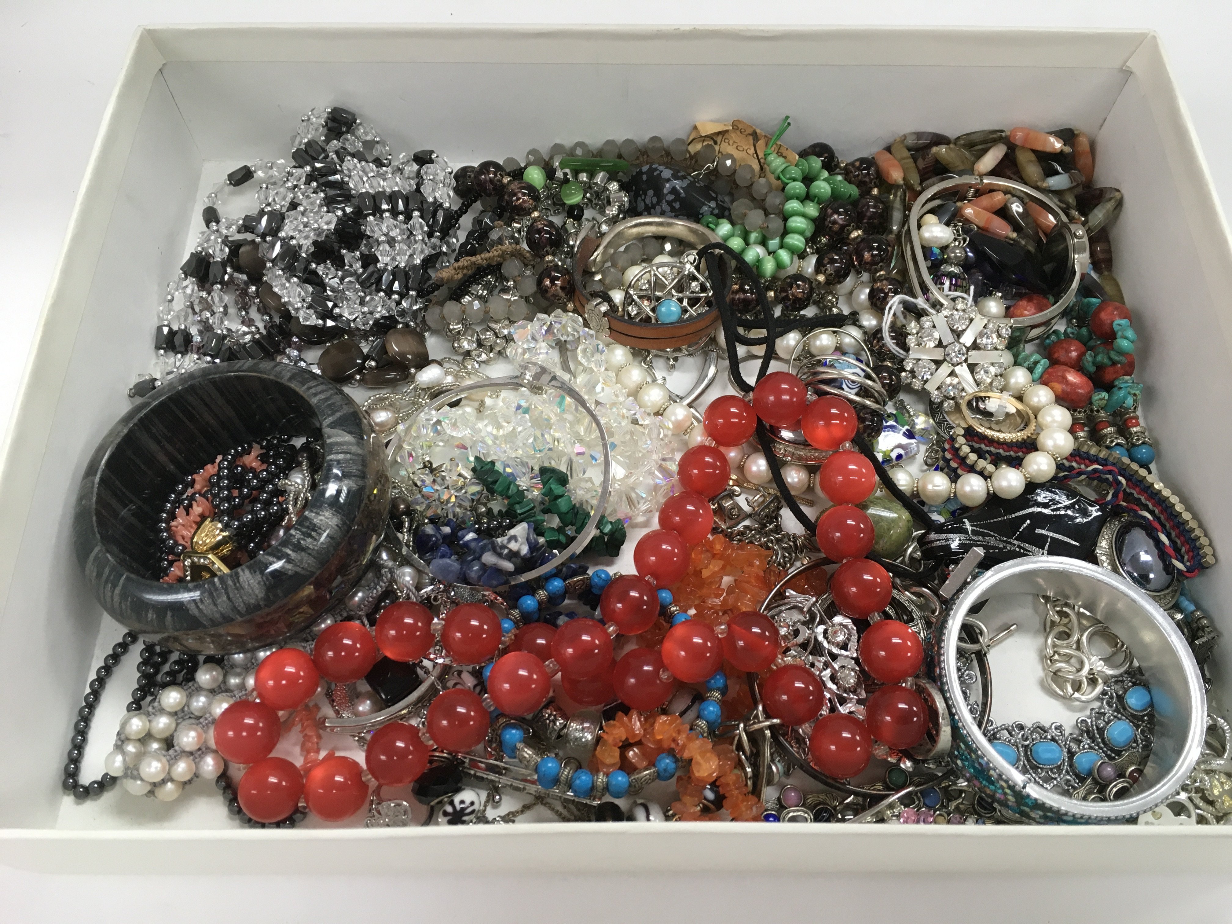 A further tray of costume jewellery.