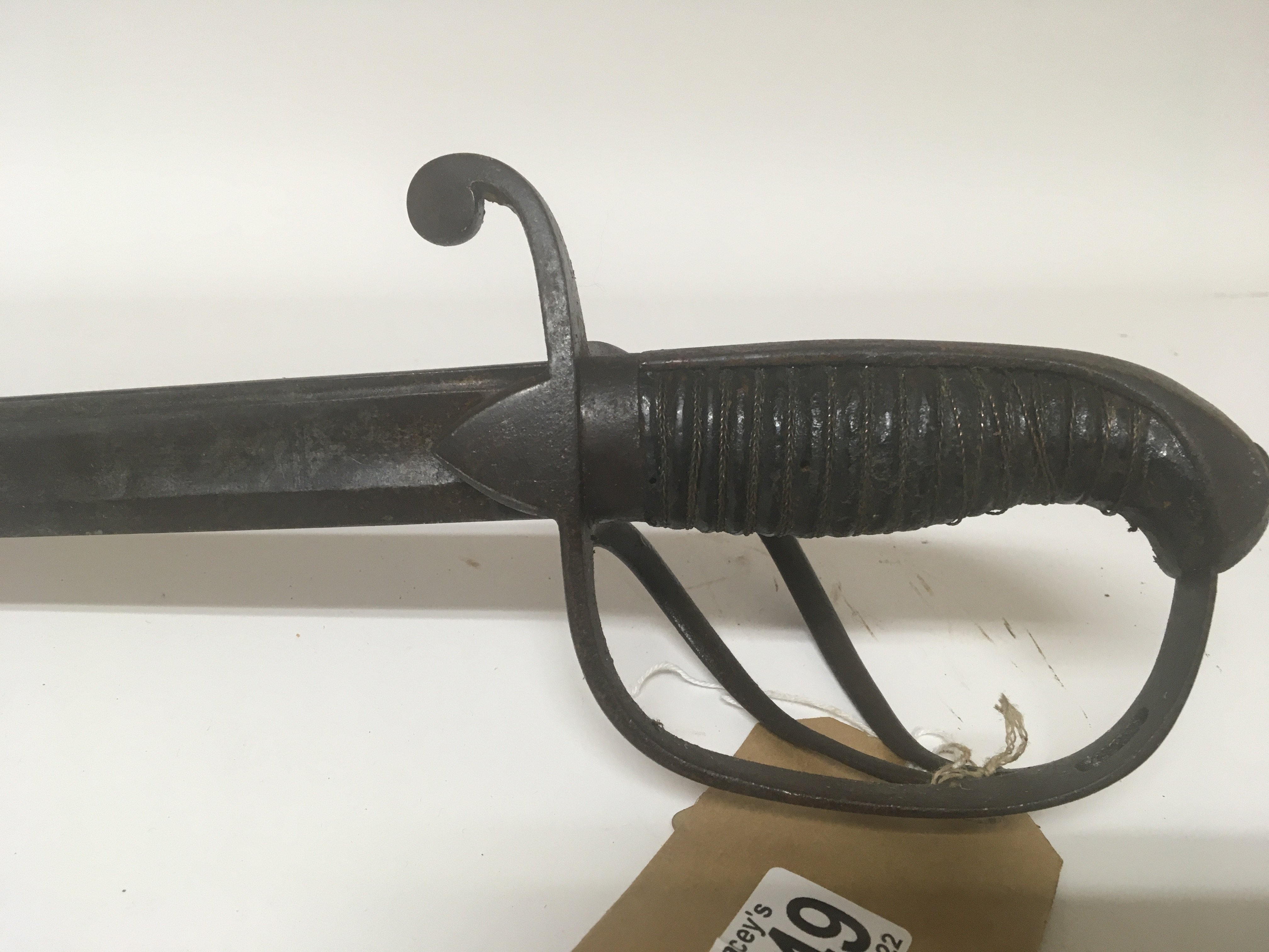 An Antique Sword with a scroll open guard wired grip and lightly ...