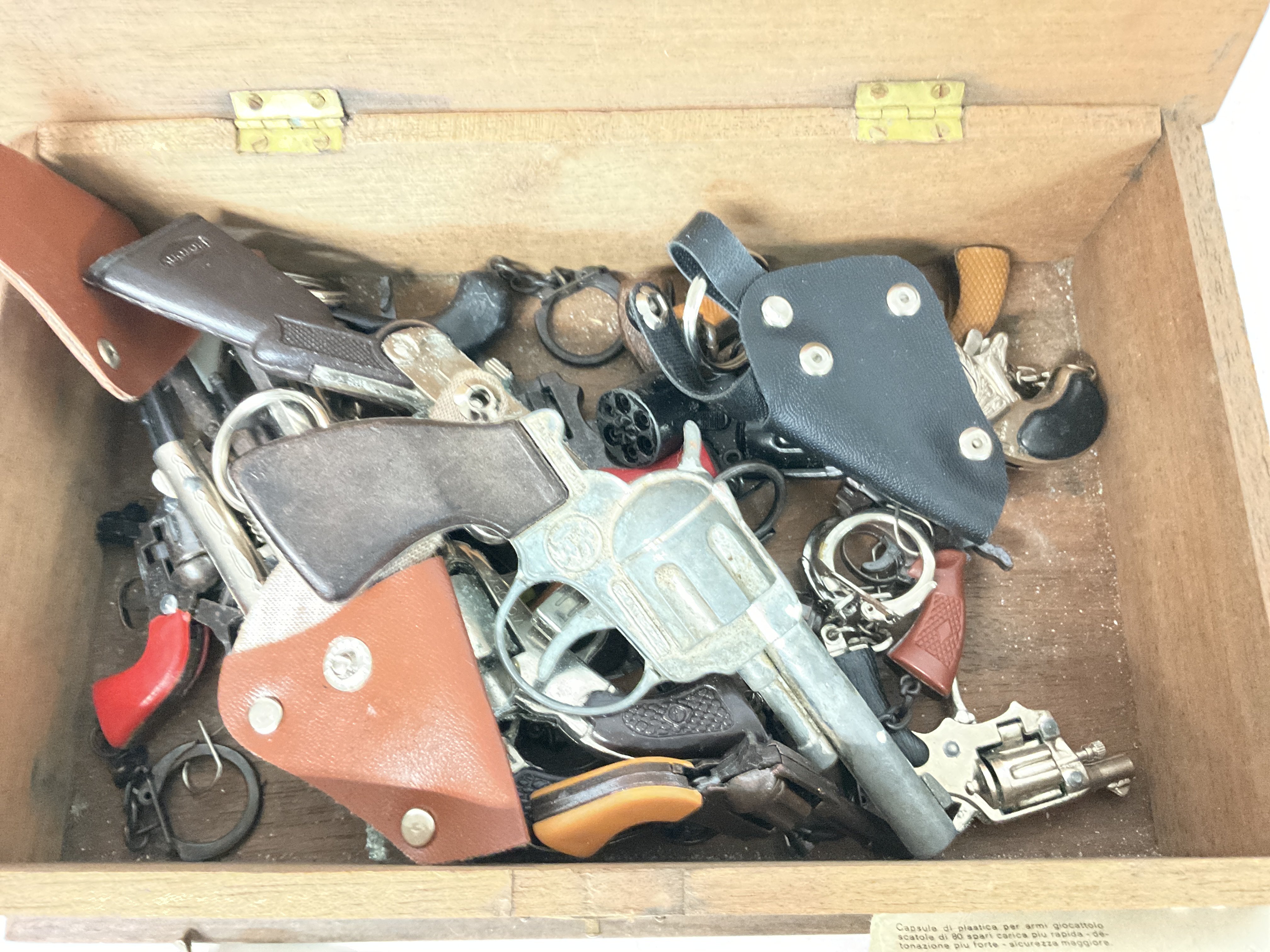 Box of novelty pistols