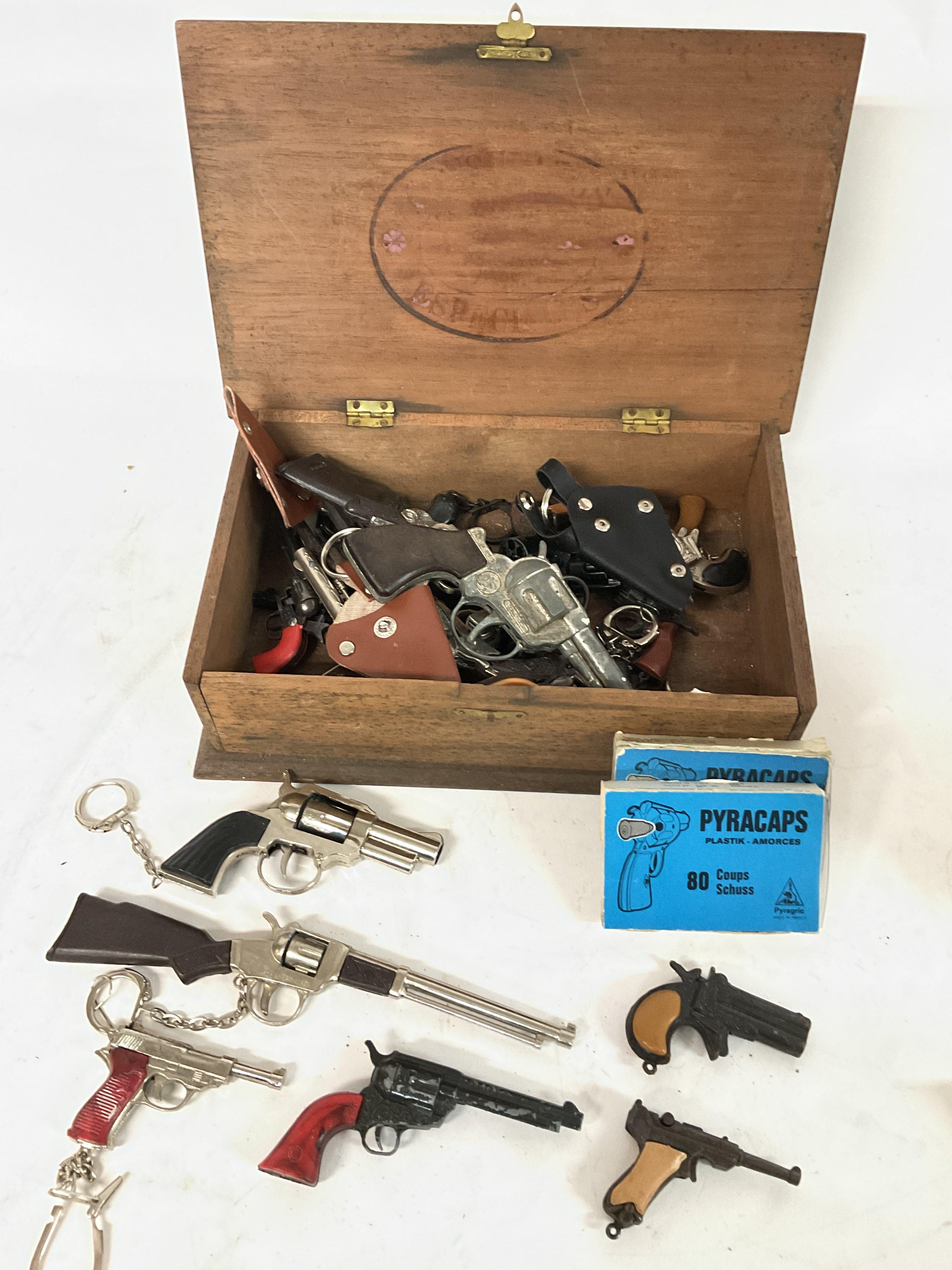 Box of novelty pistols