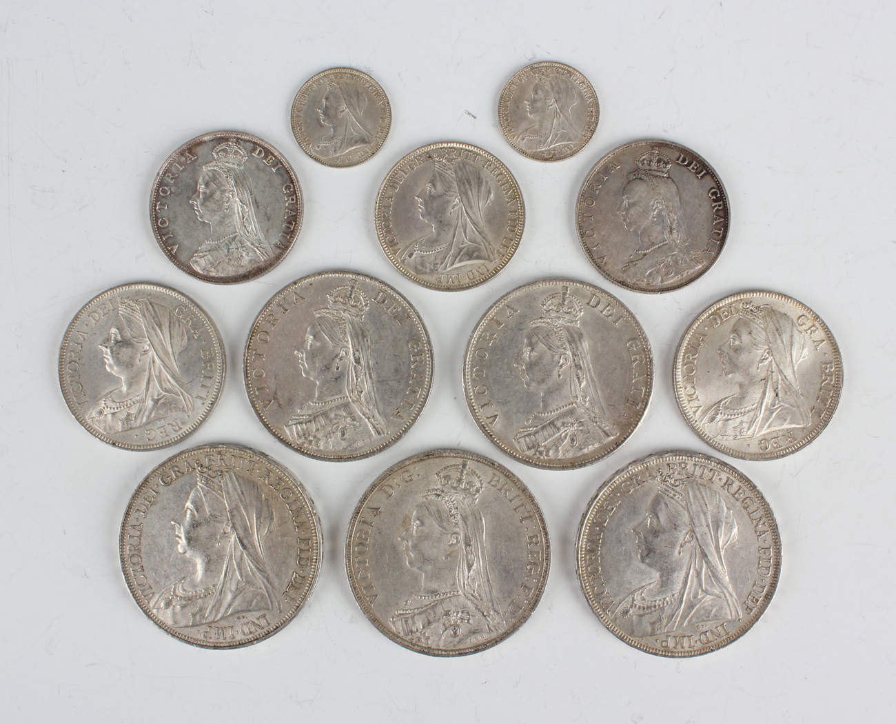 A collection of Victorian silver coinage, including three crowns, 1892 ...