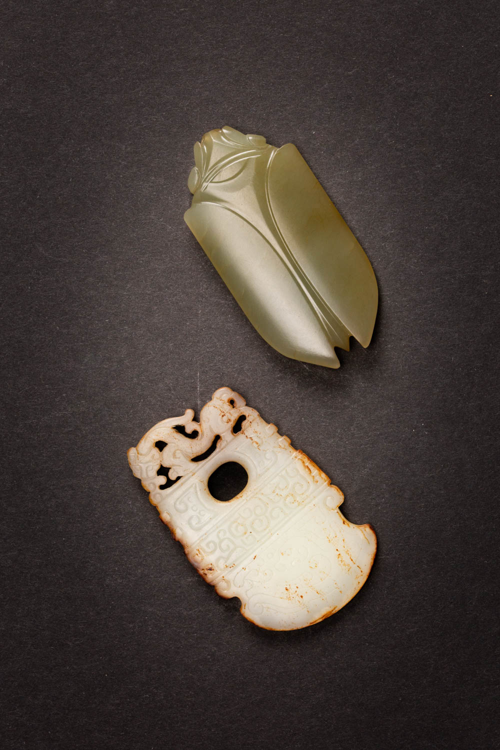 TWO CHINESE JADE CARVINGS HAN DYNASTY AND 19TH CENTURY The flattened ...