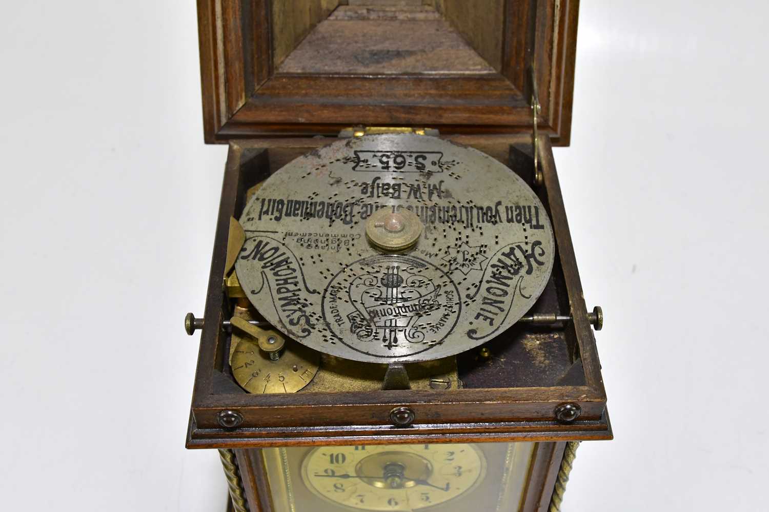 A 19th century German stained beech musical mantel clock, the hinged ...