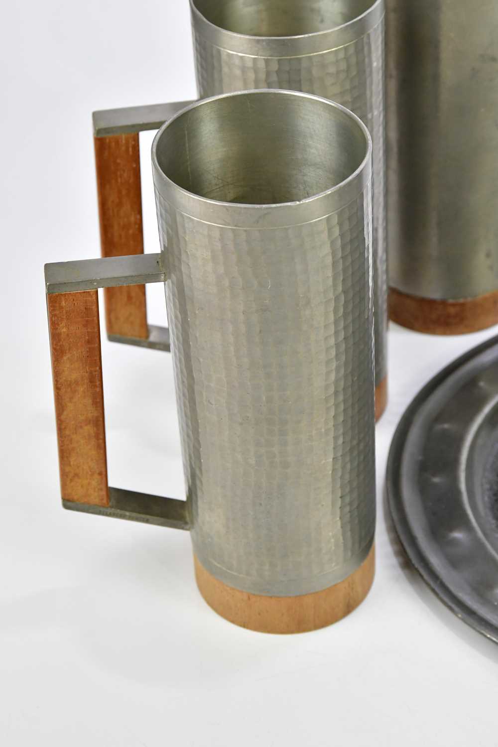 ERIC CLEMENTS FOR MAPPIN & WEBB; a silver plated three piece cruet, six ...