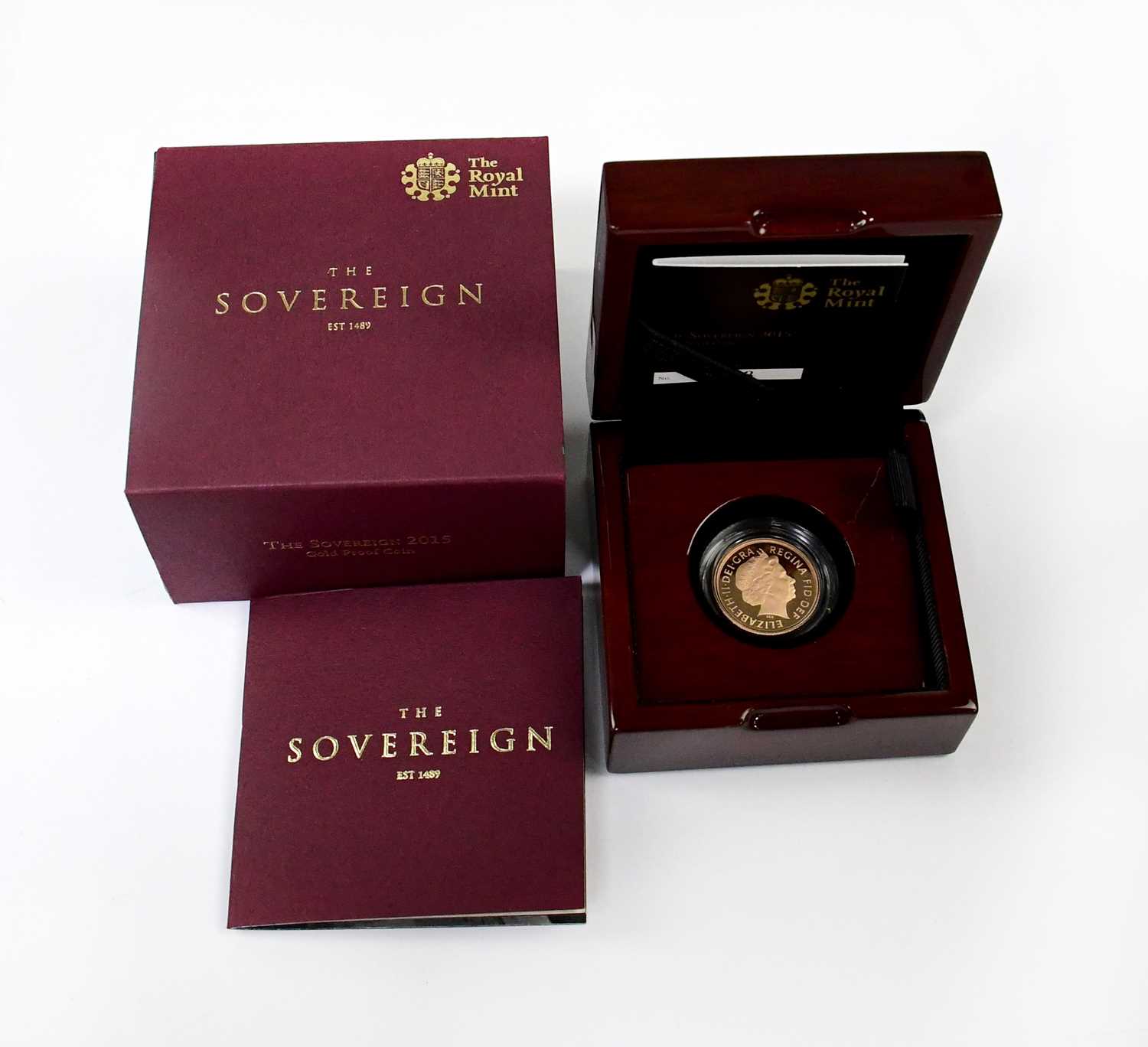THE ROYAL MINT; an Elizabeth II 2015 proof sovereign, boxed with paperwork.
