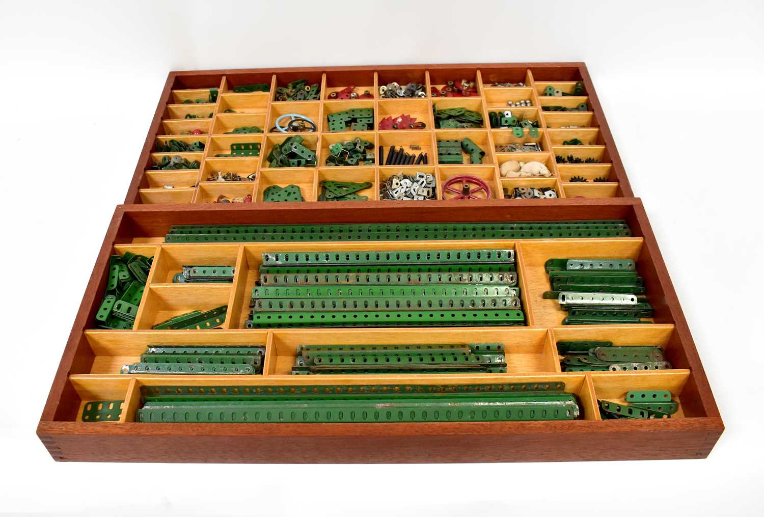 MECCANO; a large quantity of loose pieces, organised into six ...