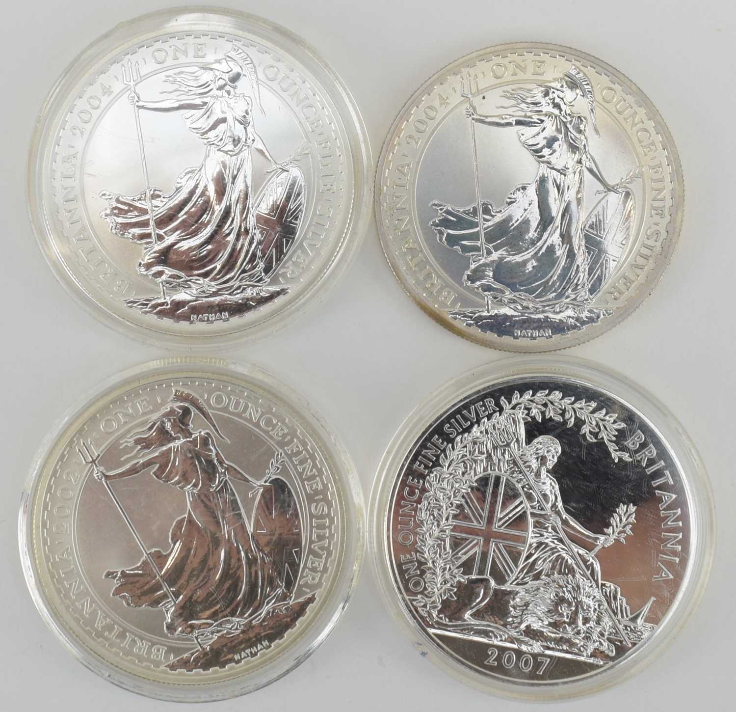 Four Britannia 1oz fine silver coins, three encapsulated, one in a ...