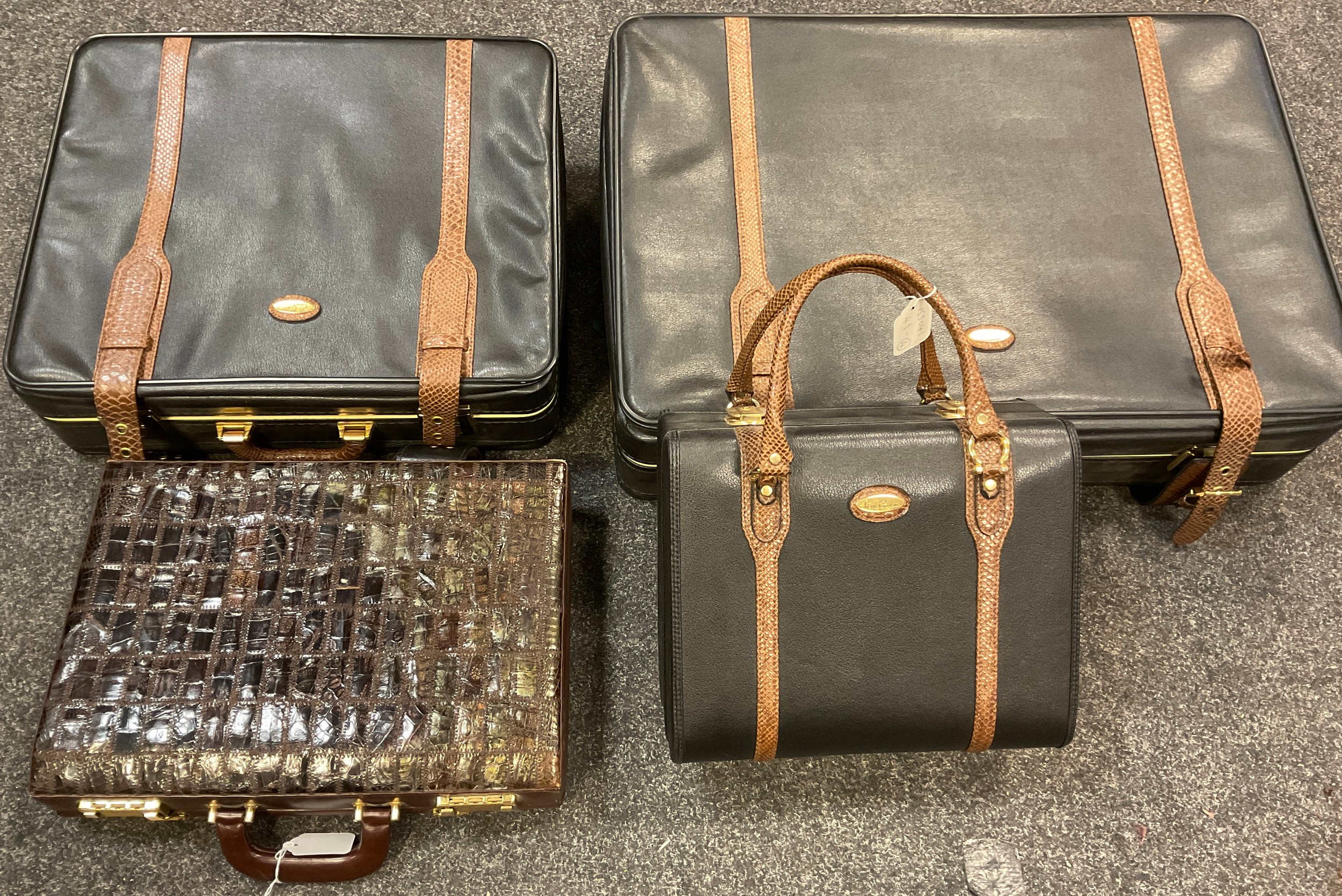 A Pierre Cardin three piece luggage set; a patent mock crock brown ...
